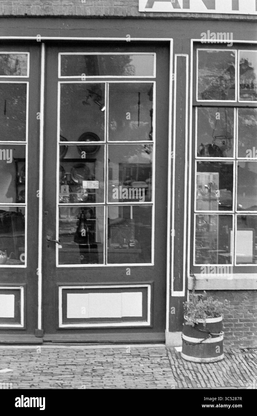 Charming storefront features large panes hi-res stock photography and ...