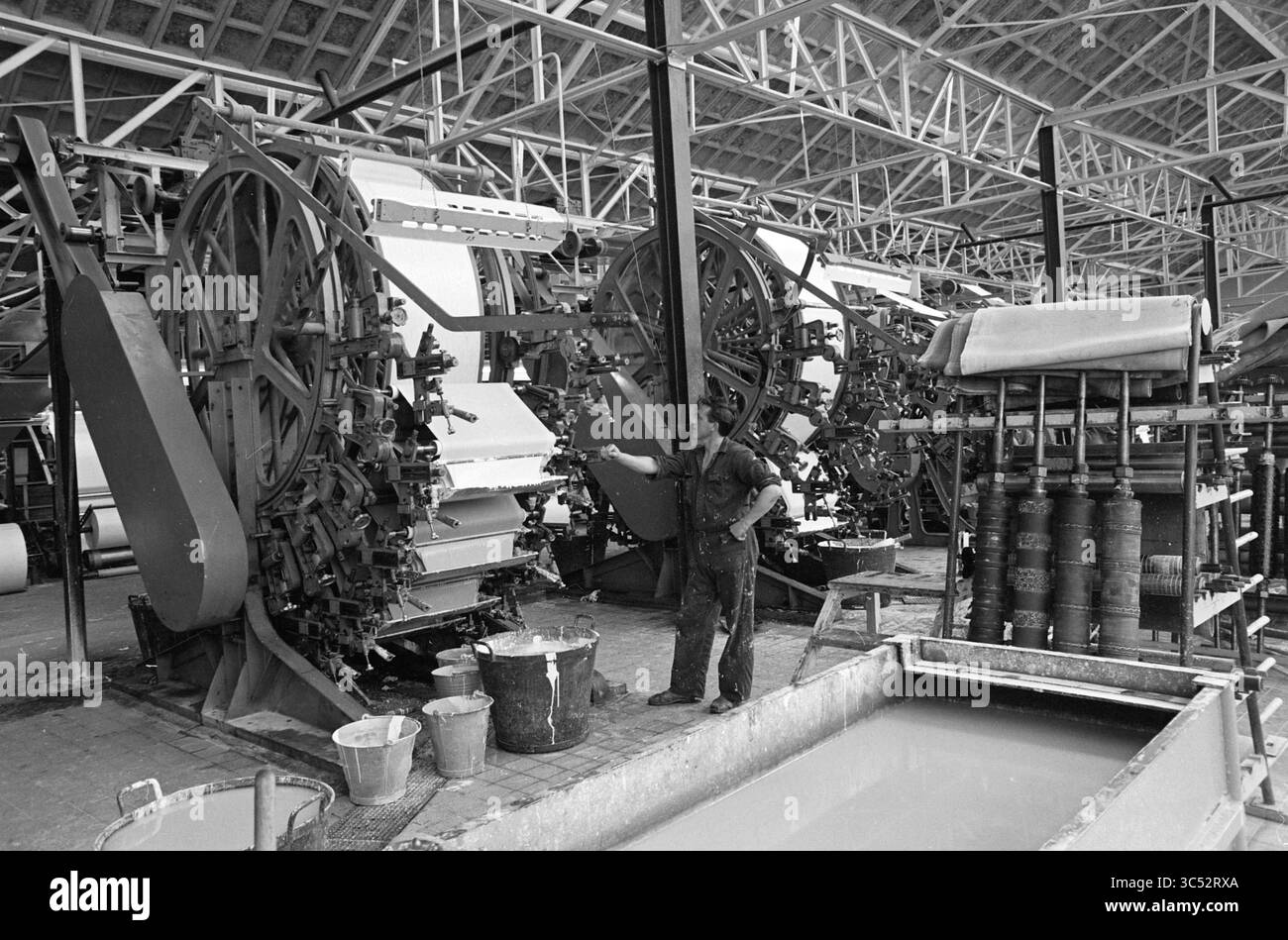 Factory worker operates large hi-res stock photography and images - Alamy