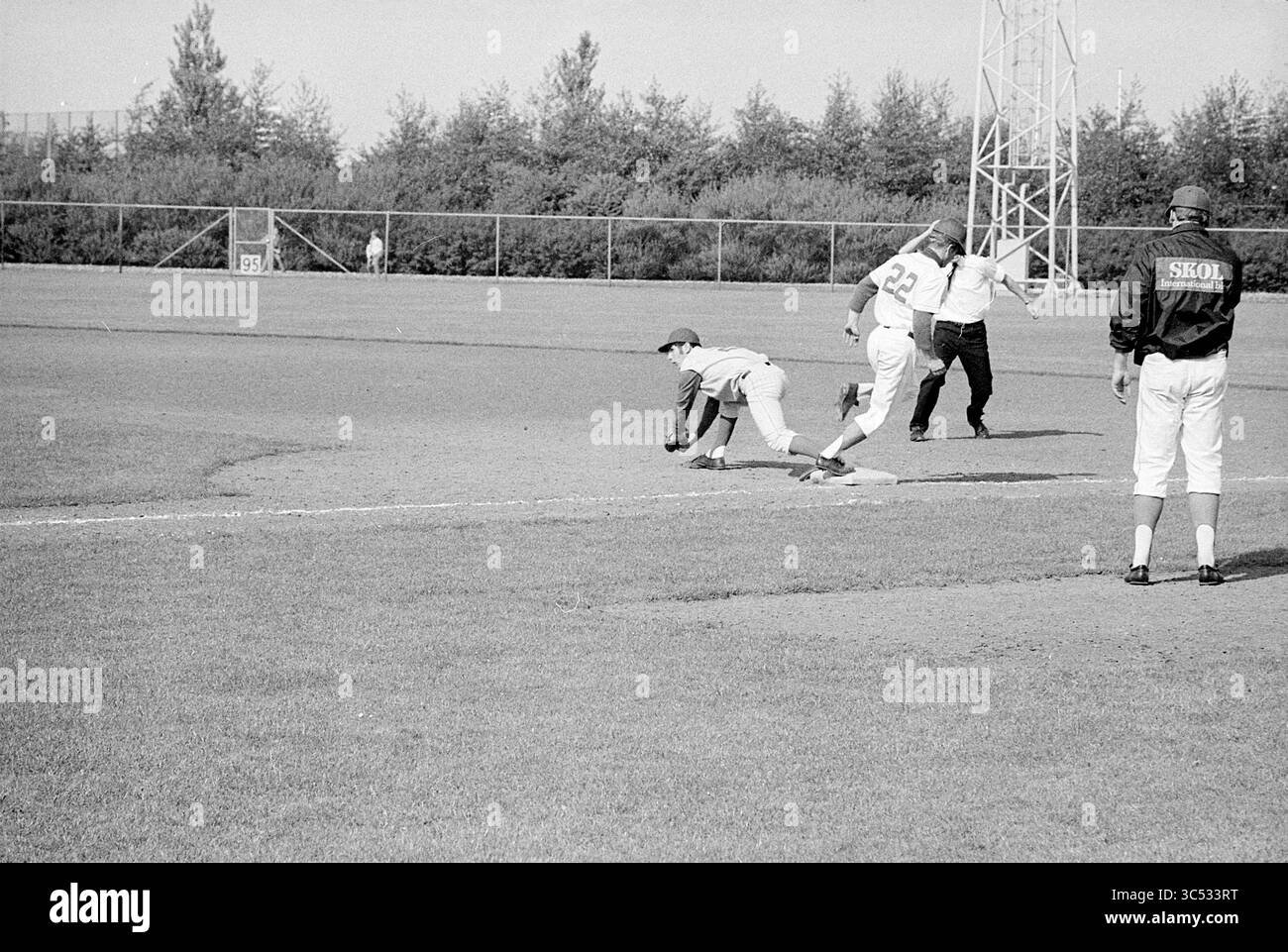 Young baseball player slides towards base hi-res stock photography and ...