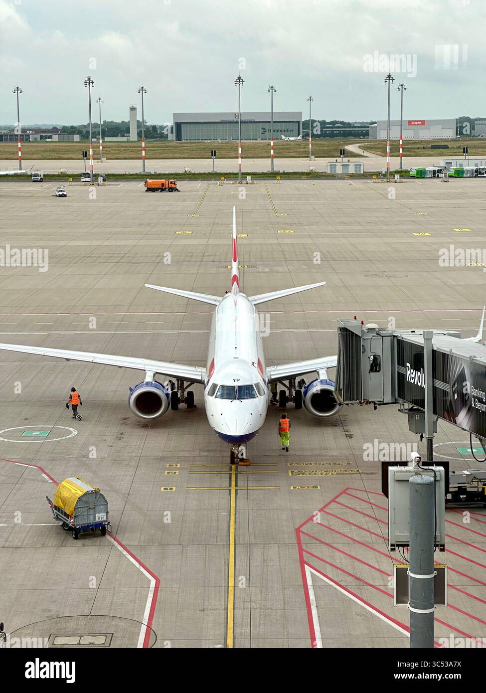 A British airways Embraer city hopper airplane waiting at the gate at ...