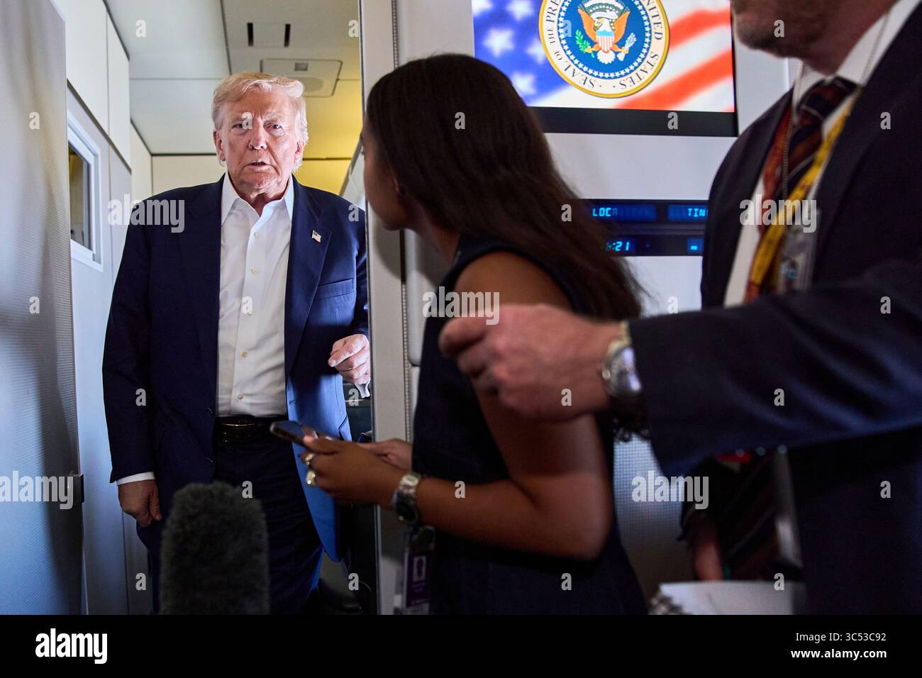 President Donald Trump speaks with reporters aboard Air Force One after ...
