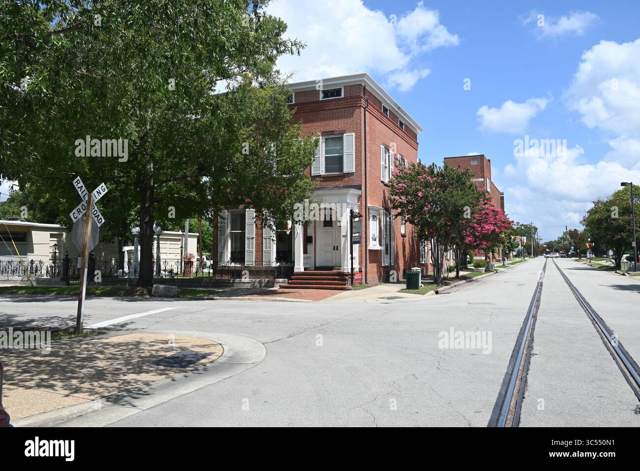 Railroad tracks run down the center of Hancock Street in historic ...