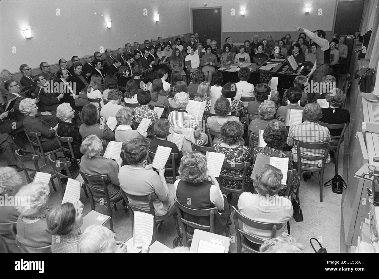 Large group people seated Black and White Stock Photos & Images - Alamy