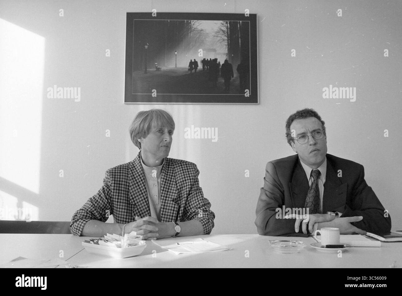 Two seated figures engaged Black and White Stock Photos & Images - Alamy