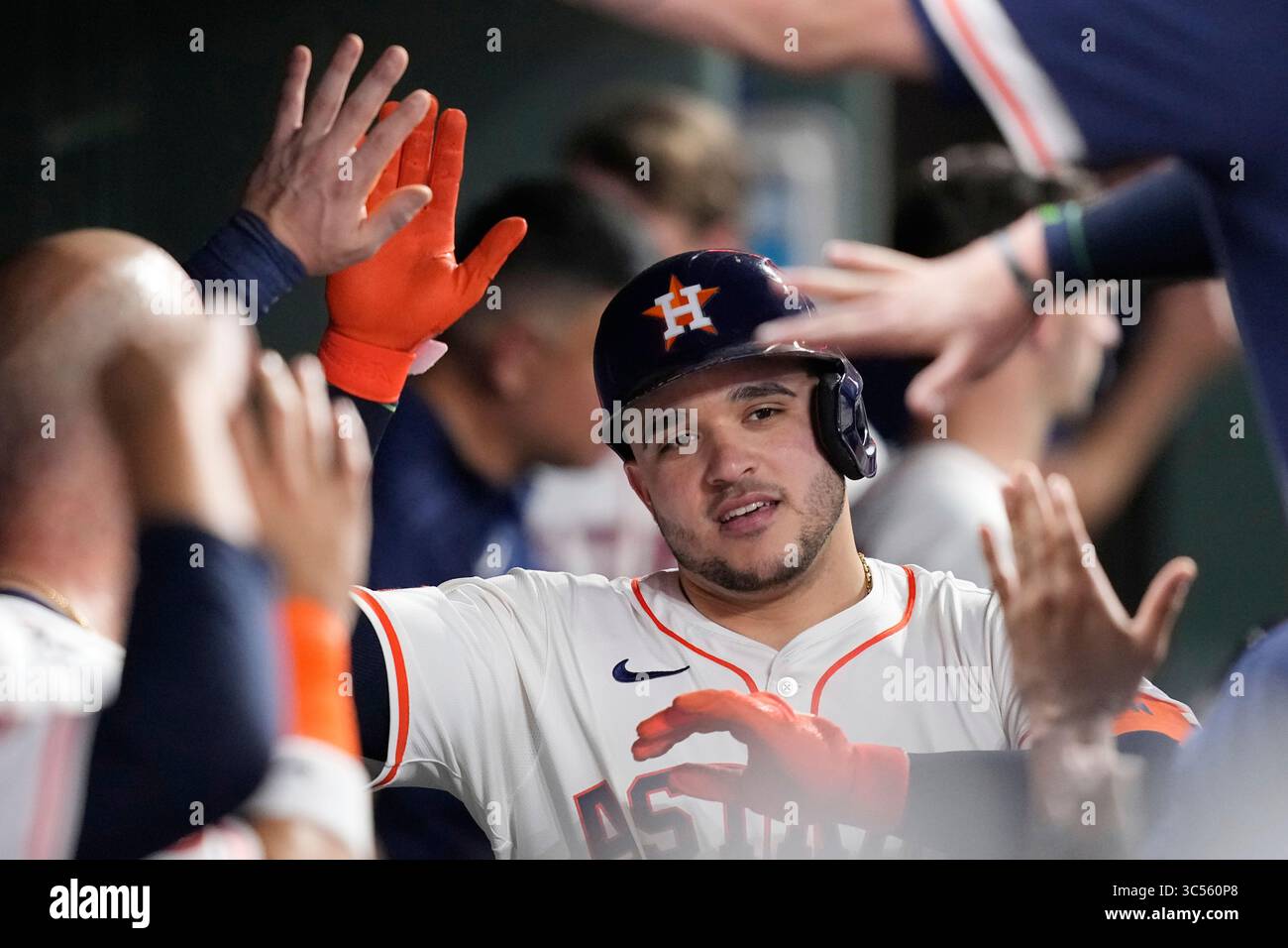 Houston Astros' Yainer Diaz celebrates in the dugout after hitting a ...