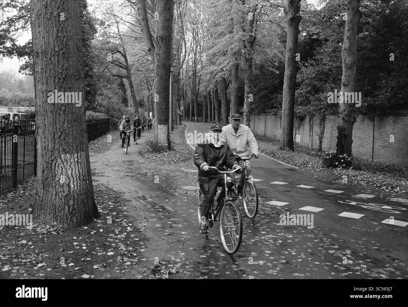 Cyclists on two way Black and White Stock Photos & Images - Alamy