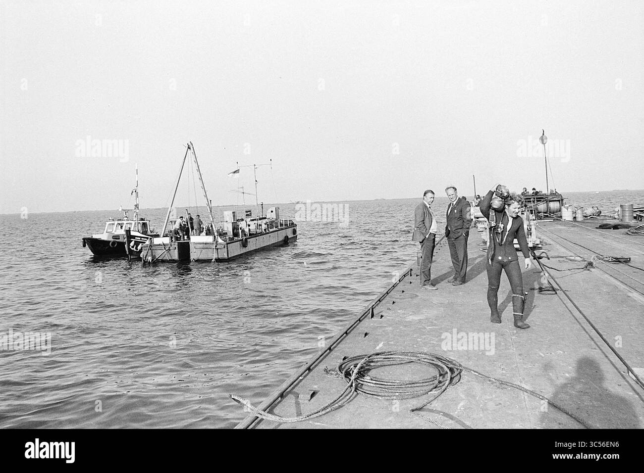 Two men work water Black and White Stock Photos & Images - Alamy