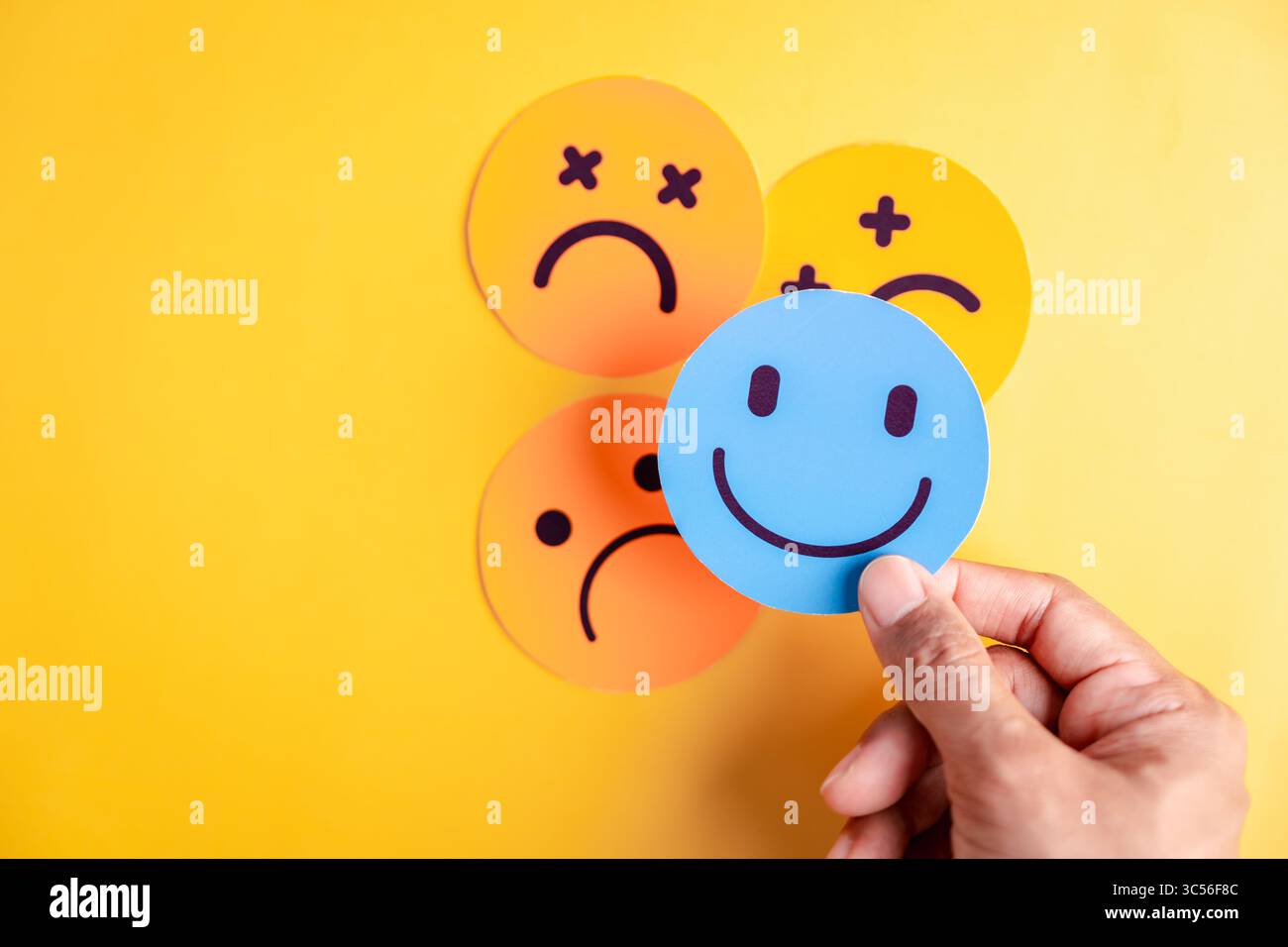 Choosing a happy smiley face for positive feedback, emotional rating ...