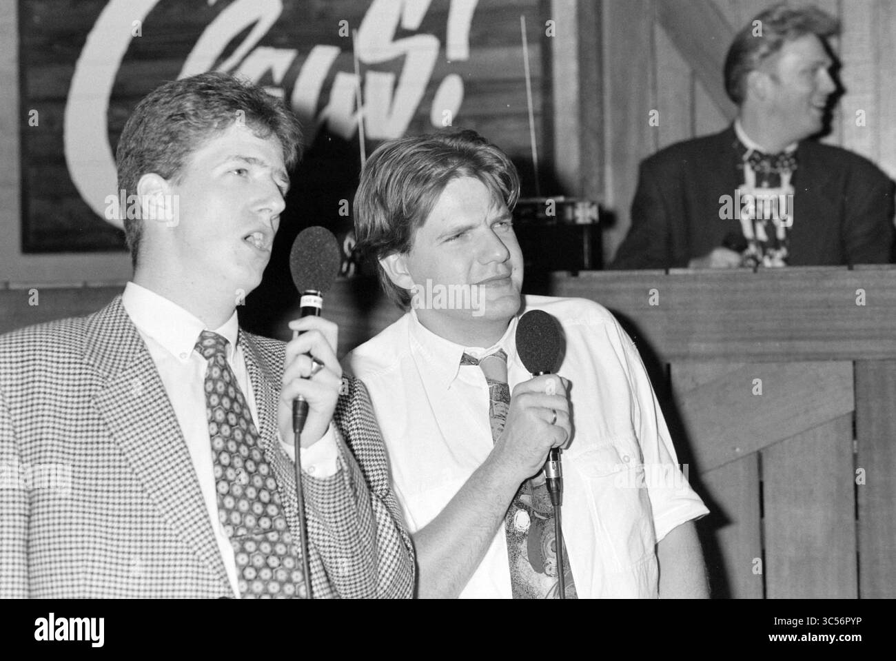 Two men in suits on stage Black and White Stock Photos & Images - Alamy