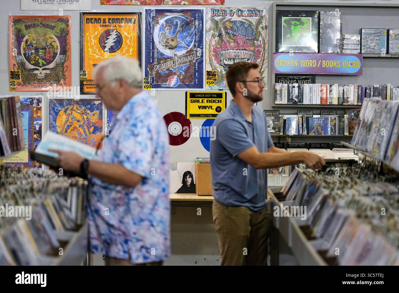 People browse through vinyl records inside Amoeba Music in San ...