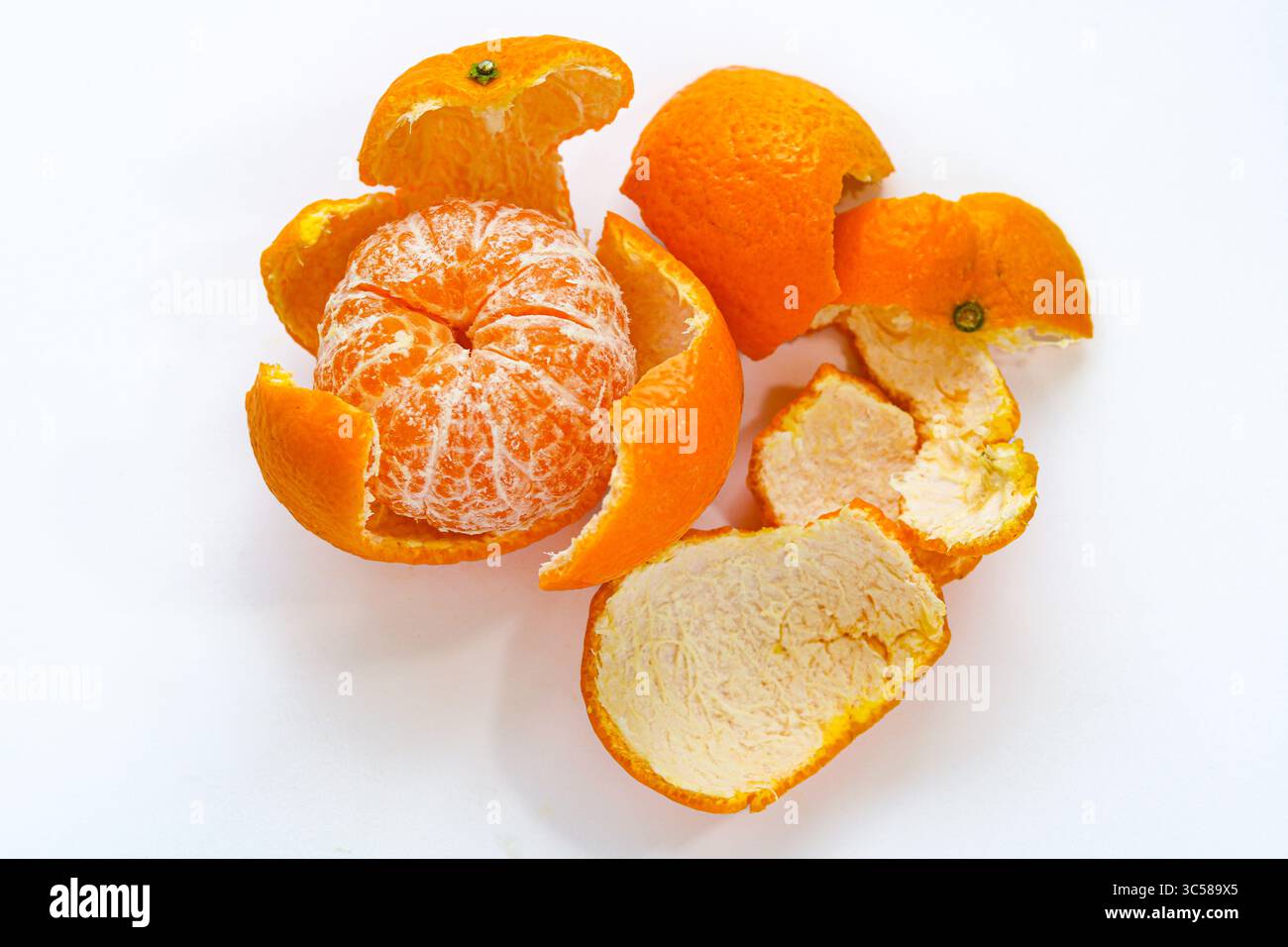 Freshly peeled Mandarin Honey Murcott revealing its juicy orange flesh ...