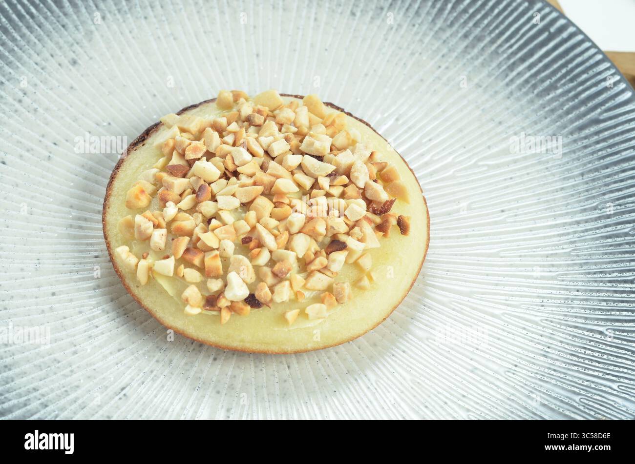Serabi pancake with peanut topping and condensed milk, a traditional ...