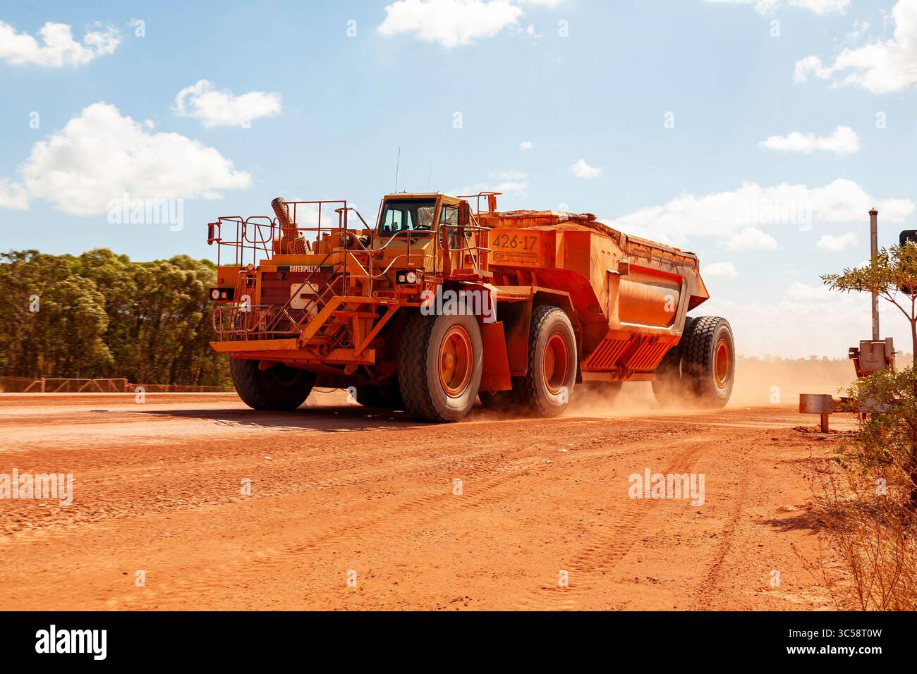mining truck motoring towards dust iron ore huge massif heavy dump ...