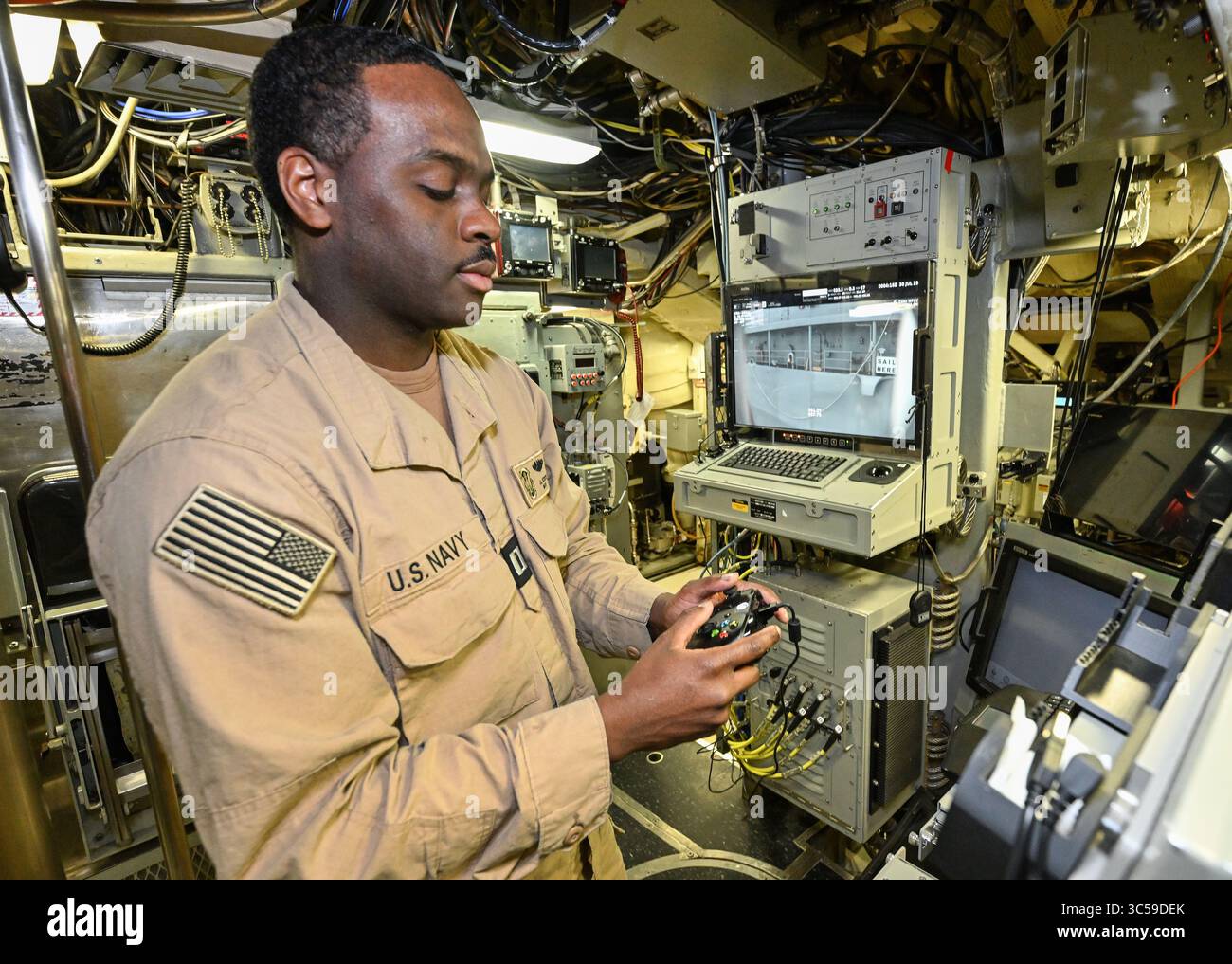 Crew are seen using a play station controller to operate the digital ...