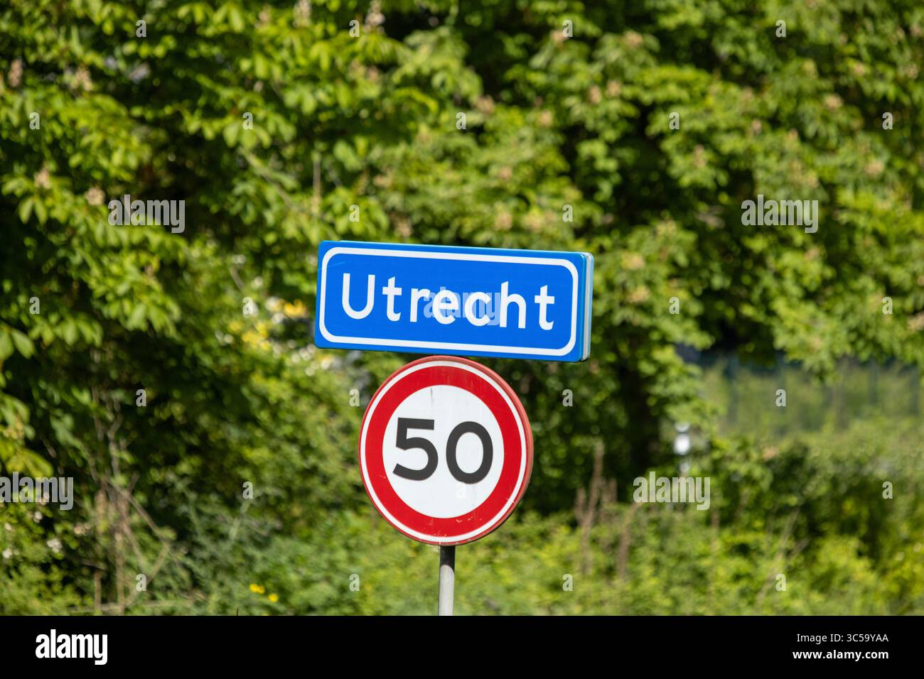 A clear "Utrecht" city entrance sign and a 50 km/h speed limit sign ...