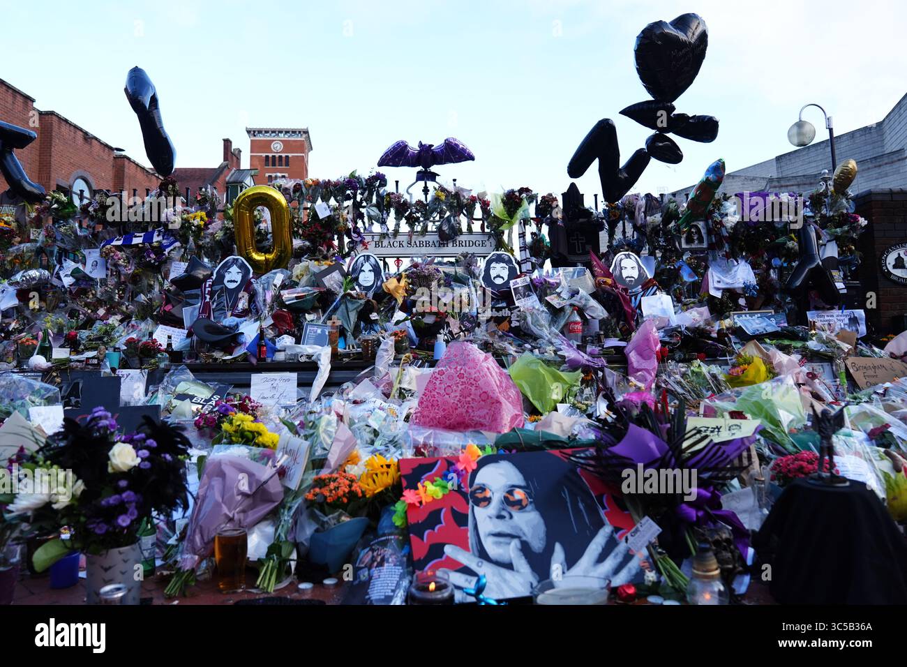 Floral tributes left at the Black Sabbath Bridge bench on Broad Street ...