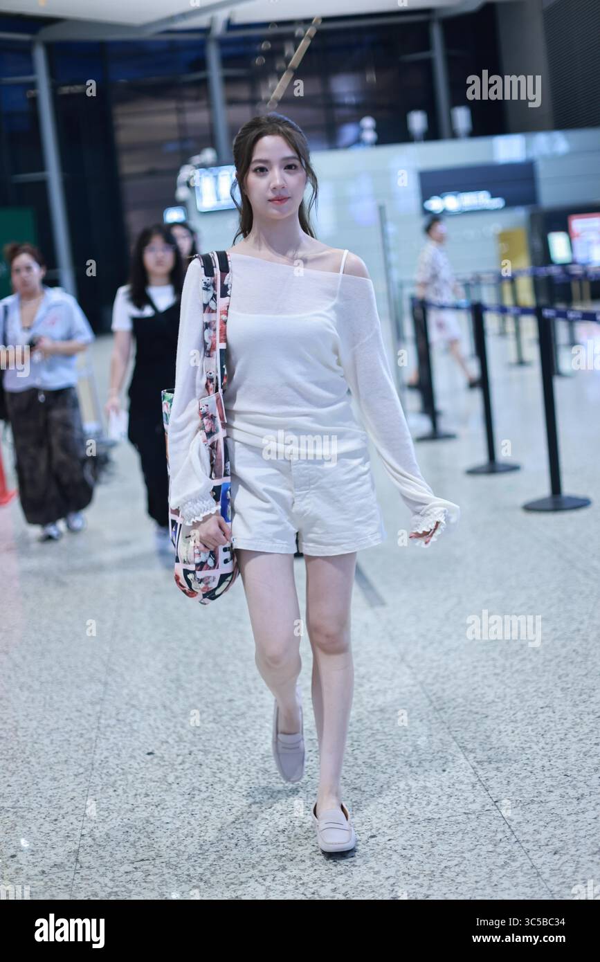 Taiwanese singer and member of girl group Gen1es Ouyang Didi appears at the airport in Shanghai ...