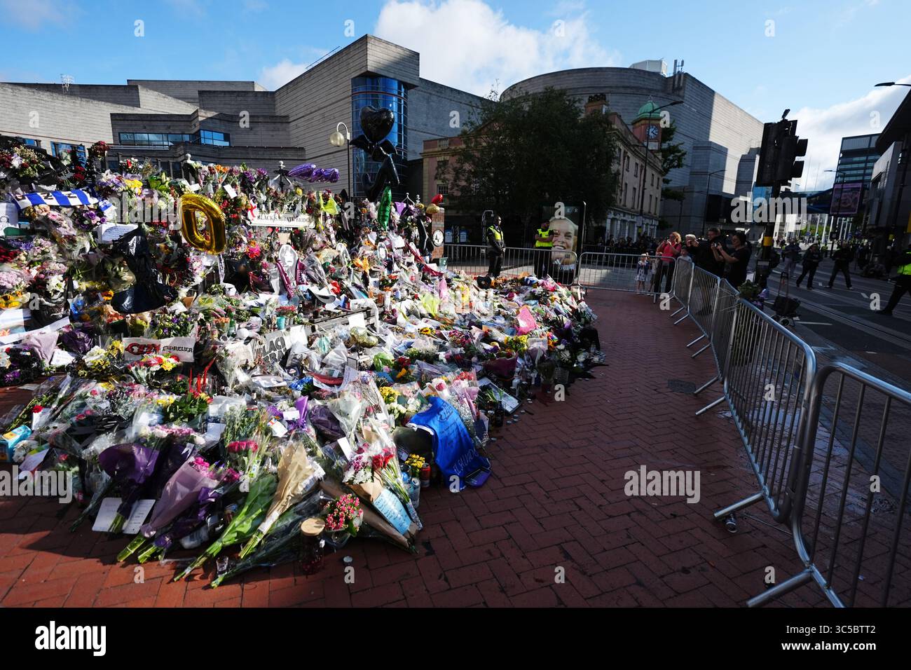 Floral tributes left at the Black Sabbath Bridge bench on Broad Street ...