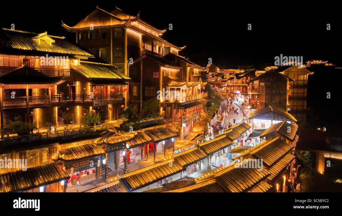 Aerial photo shows people enjoying the evening in Youzhou ancient town ...