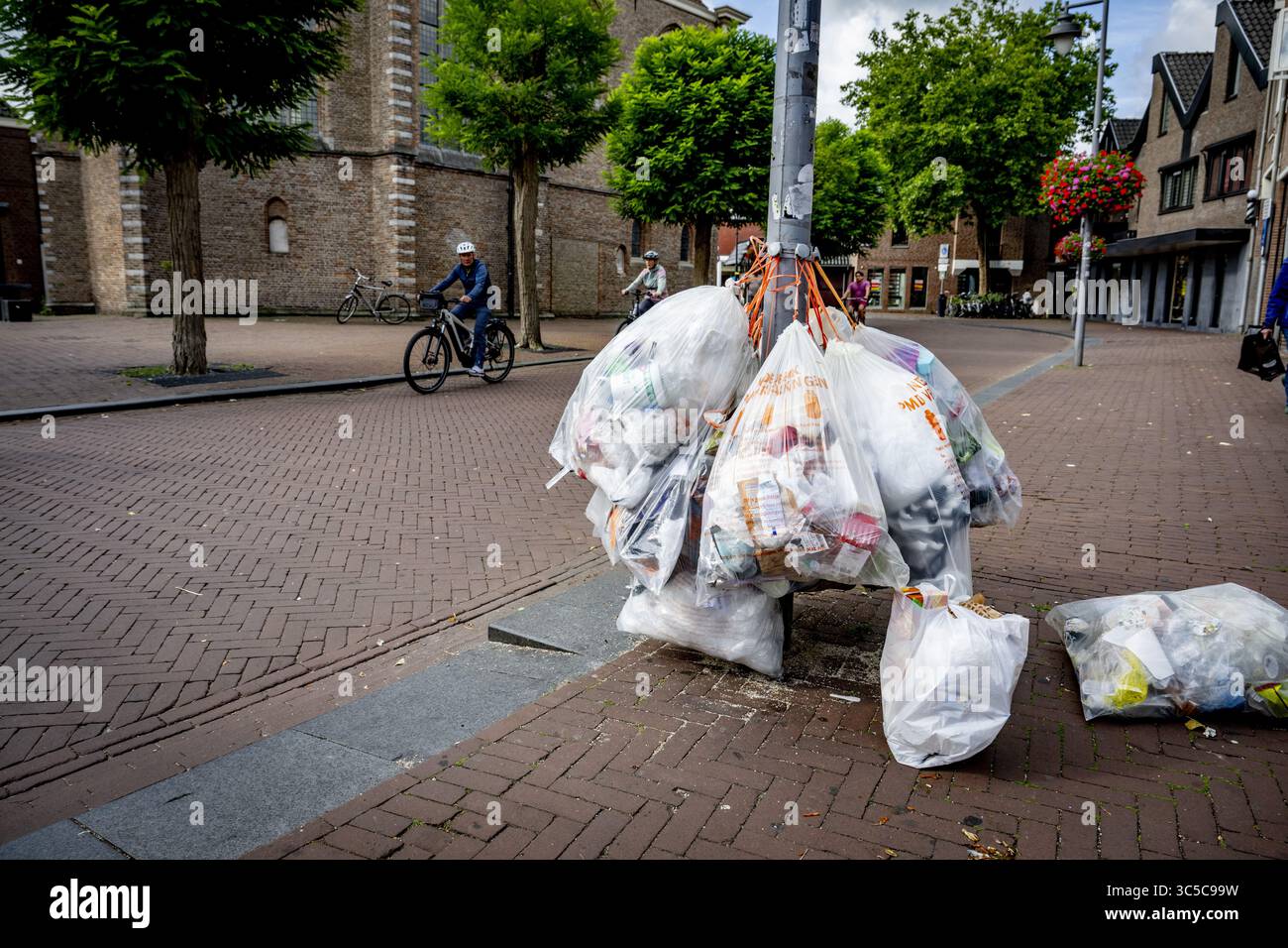 GOUDA - Garbage bags in a residential area with separated trash in ...
