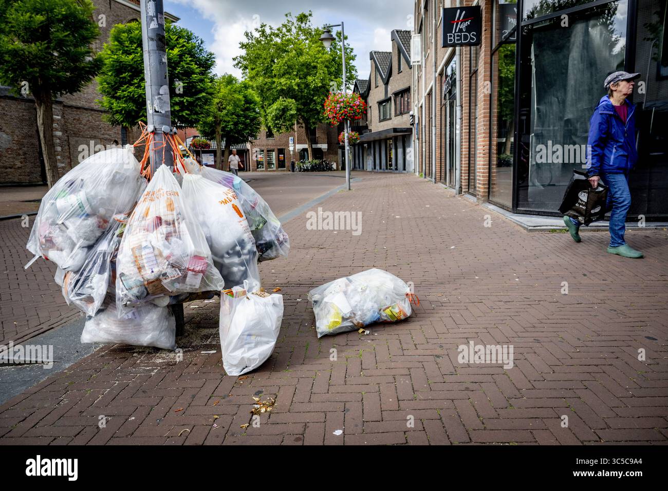 GOUDA - Garbage bags in a residential area with separated trash in ...