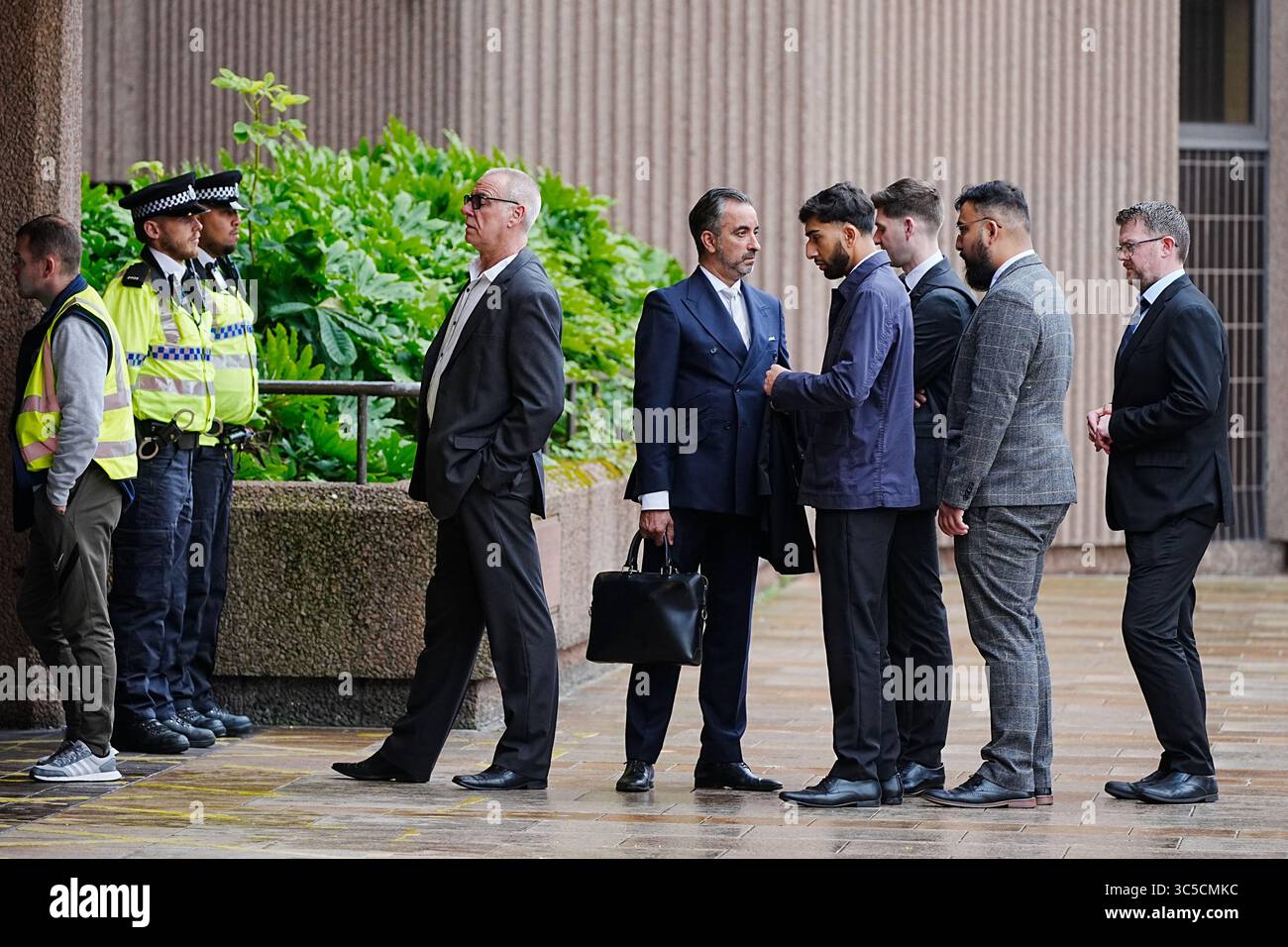 Human Rights lawyer Aamer Anwar (centre) arrives with Mohammed Fahir ...