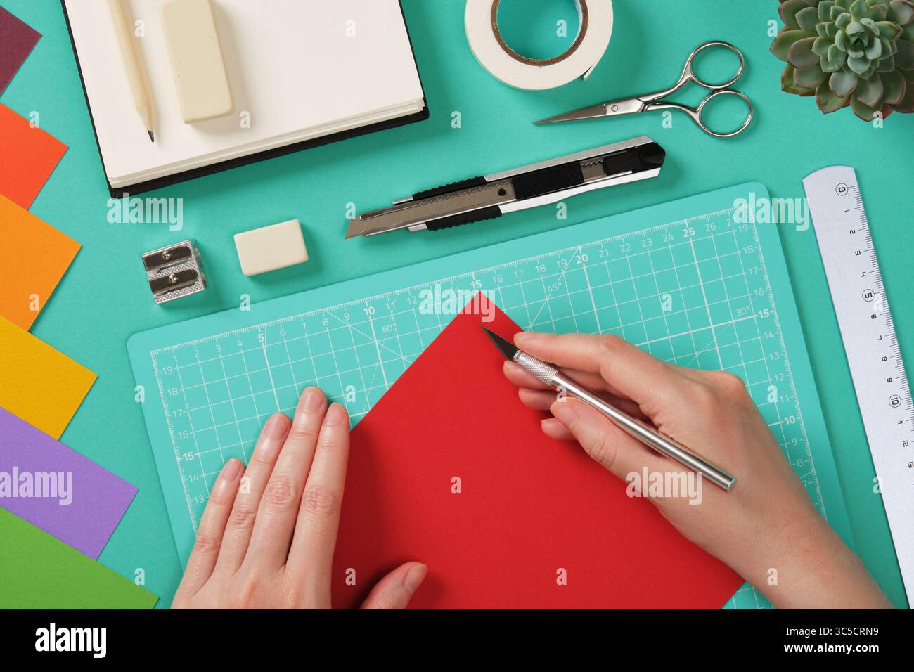 Using ruler cutter on paper hi-res stock photography and images - Alamy