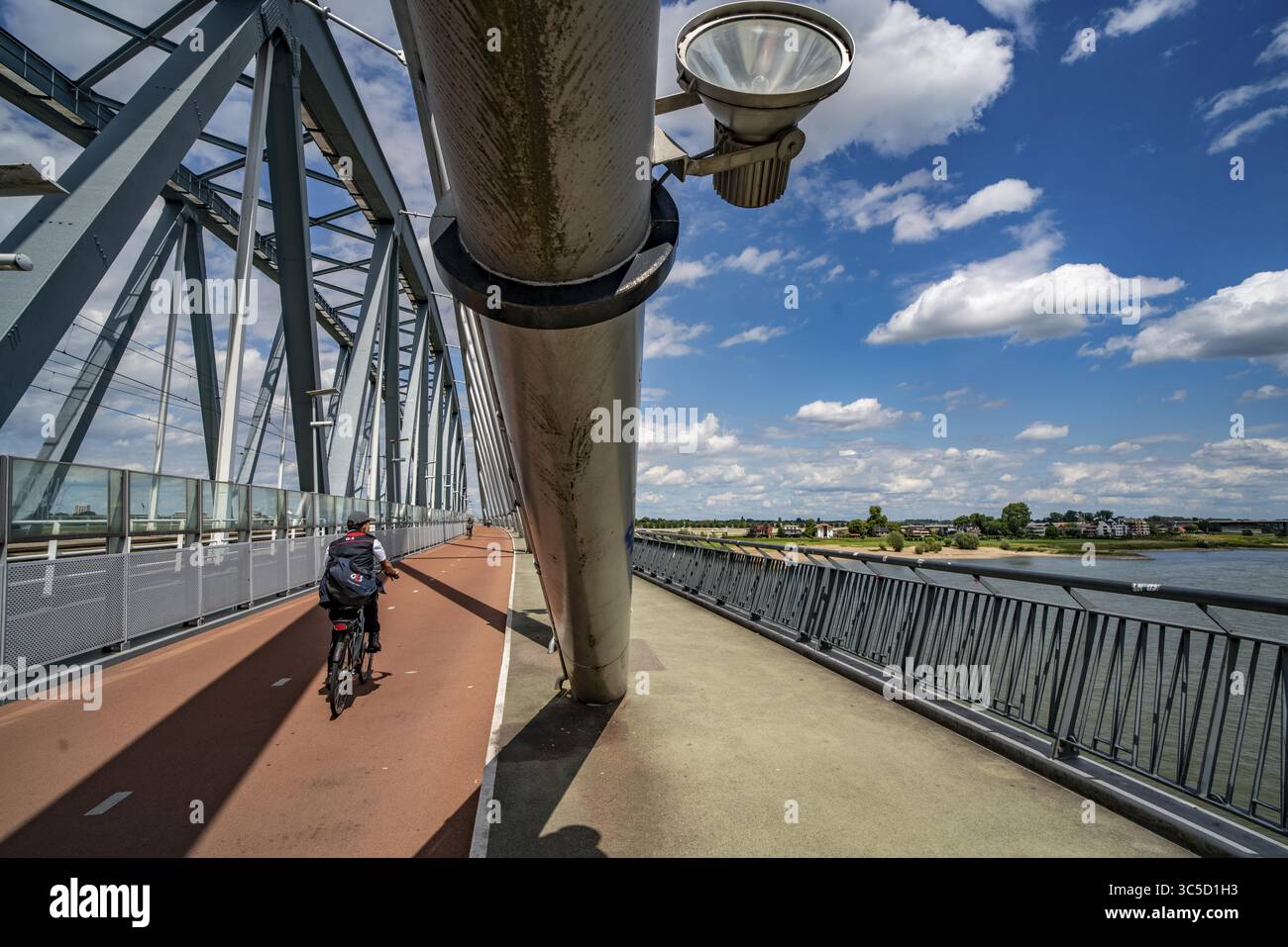Cycle and pedestrian bridge Snelbinder Brug, over the river Waal near ...