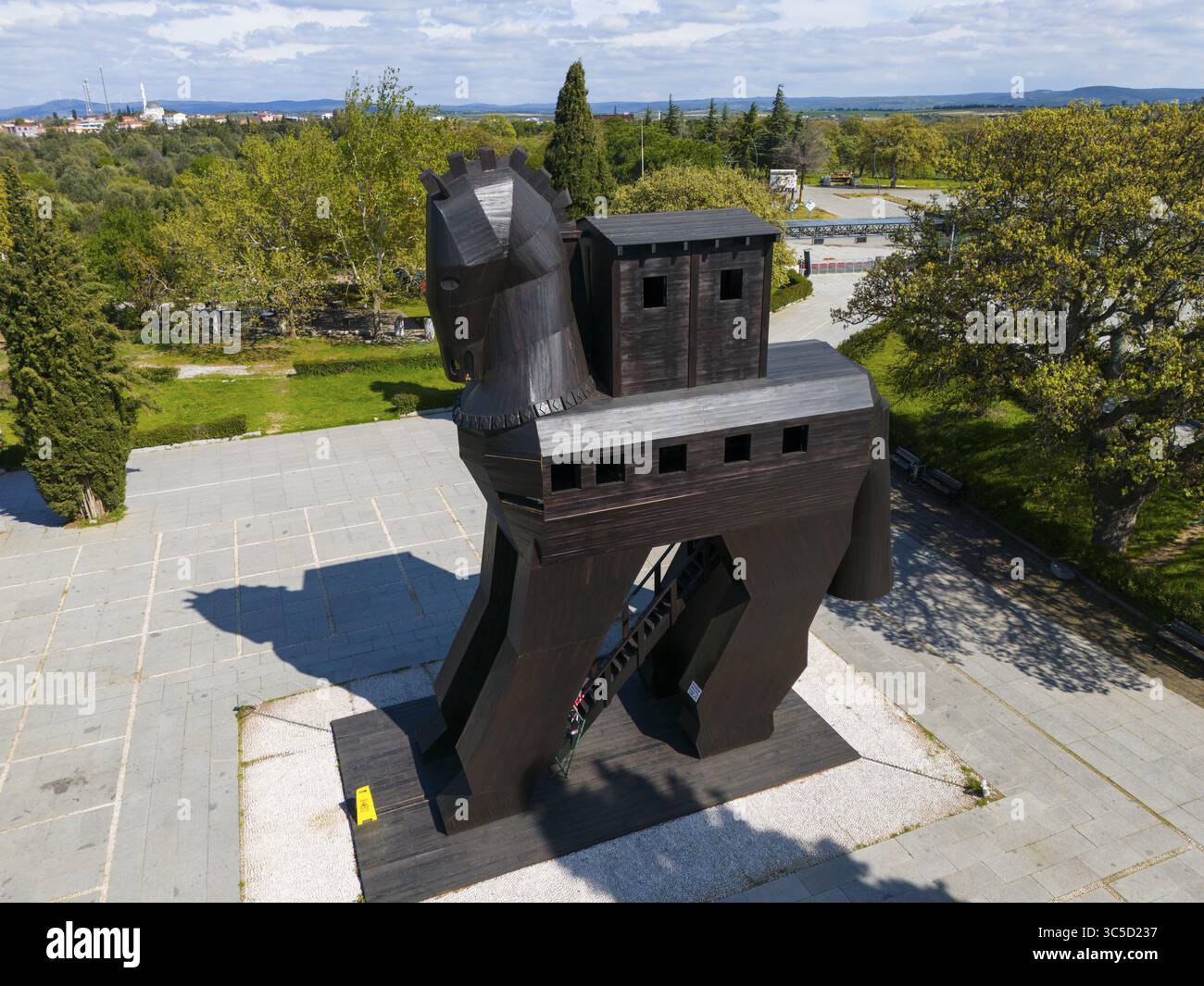 Large wooden sculpture of the Trojan Horse in an open setting, aerial ...