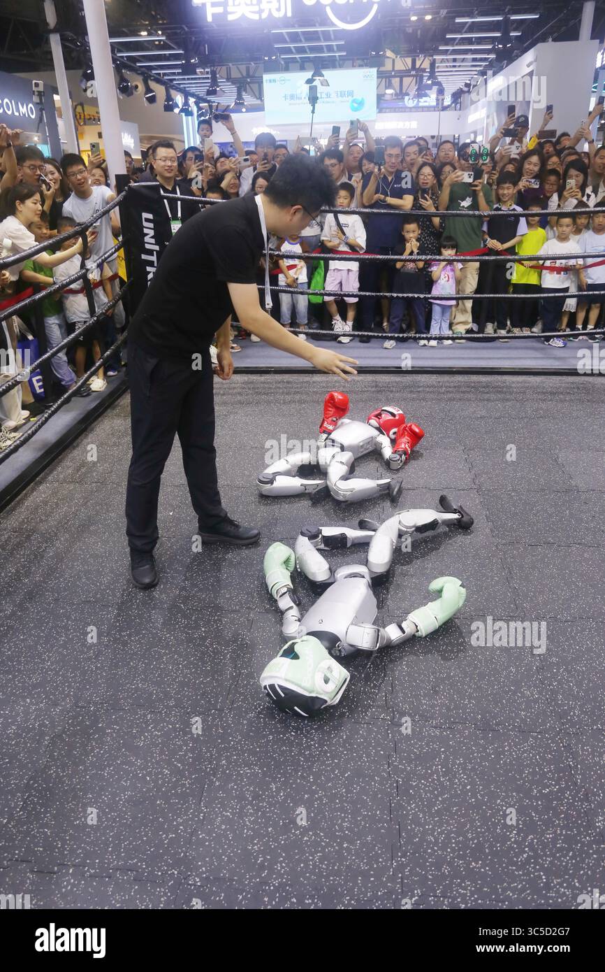 A robot boxing competition captivates visitors during the 2025 World AI ...