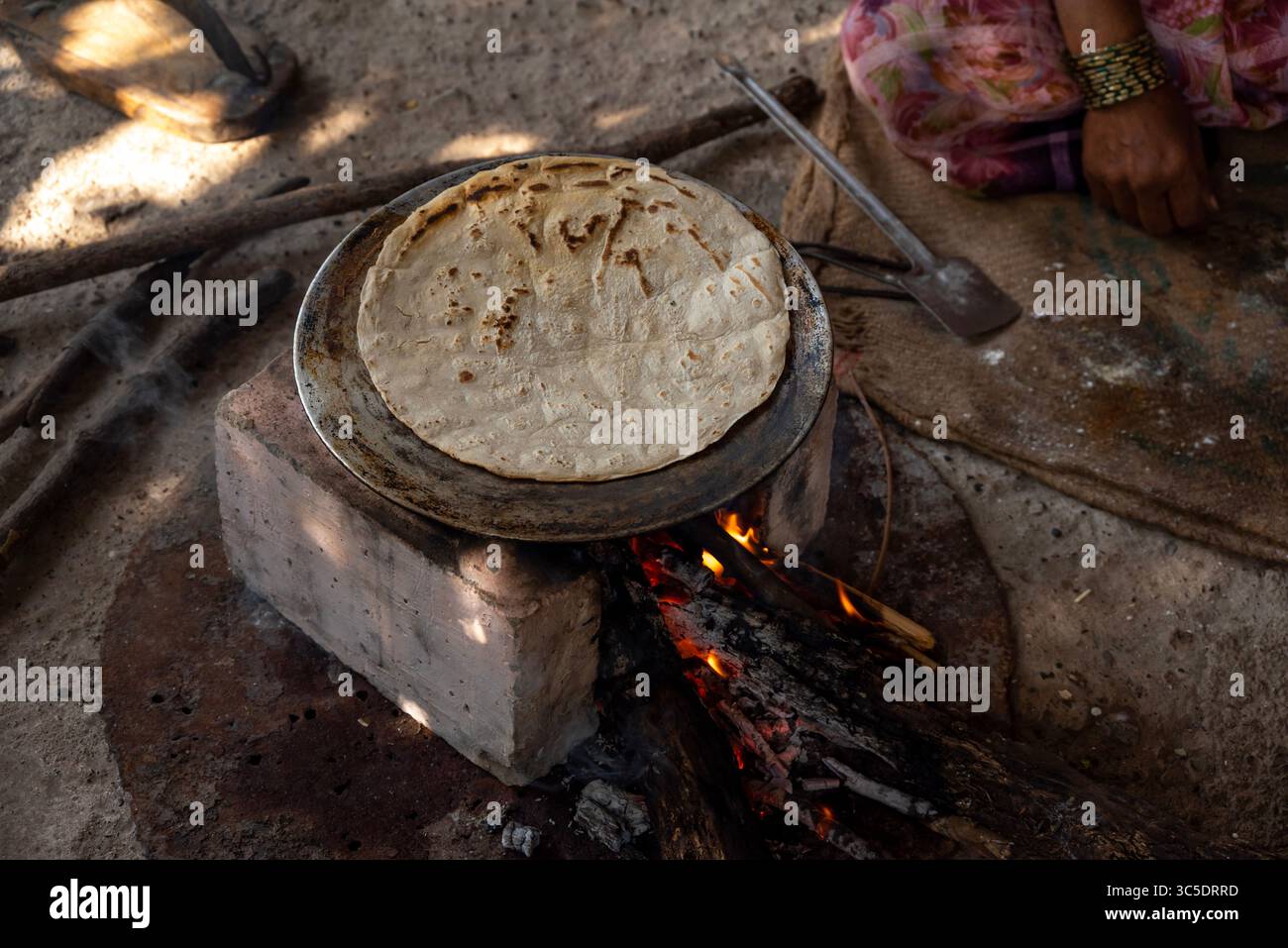 Poor woman in village cooking food. Indian village women pilgrims ...