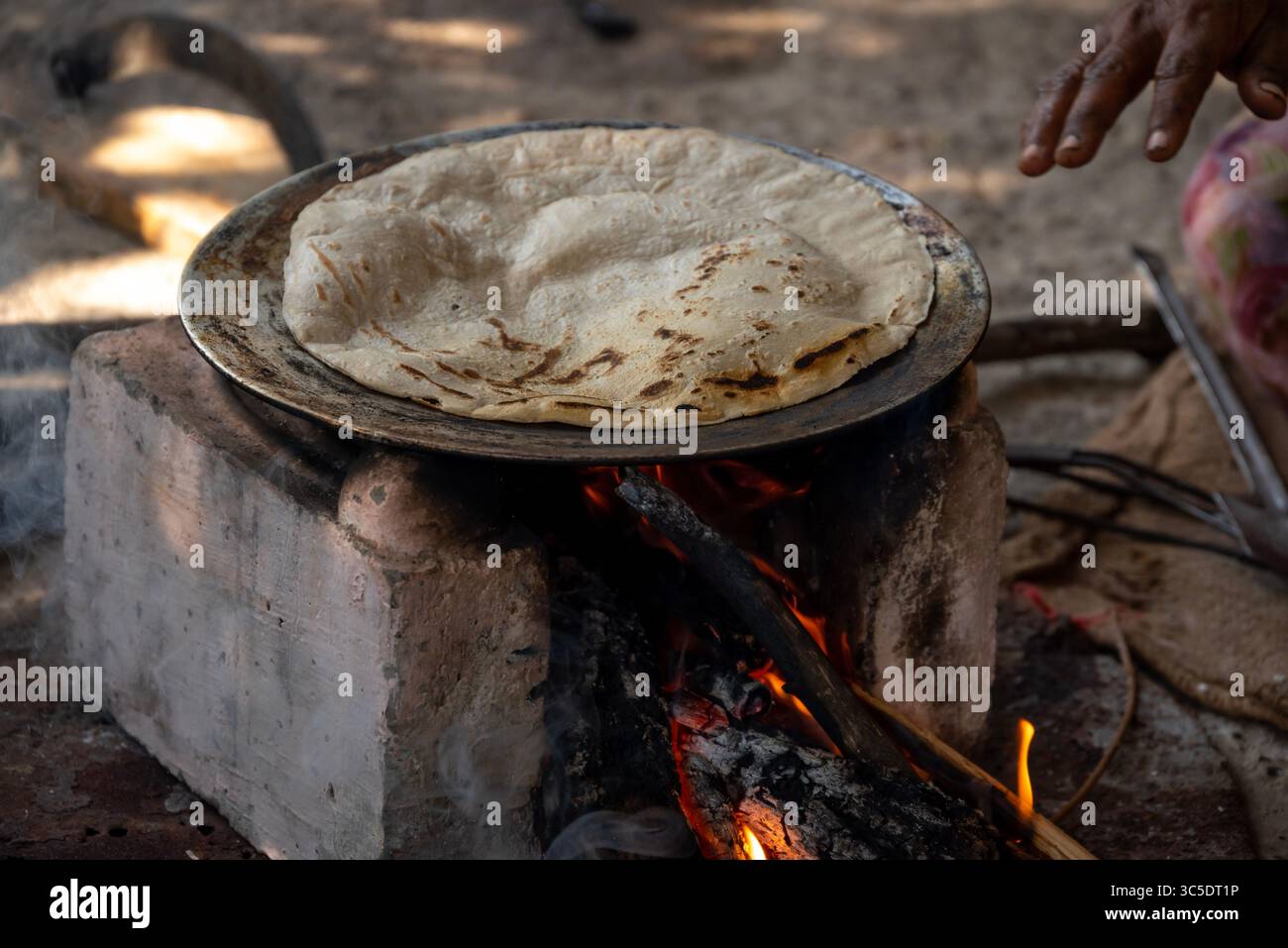 Poor woman in village cooking food. Indian village women pilgrims ...