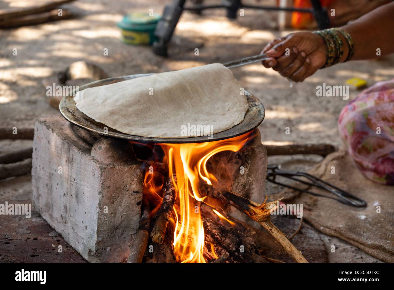 Poor woman in village cooking food. Indian village women pilgrims ...