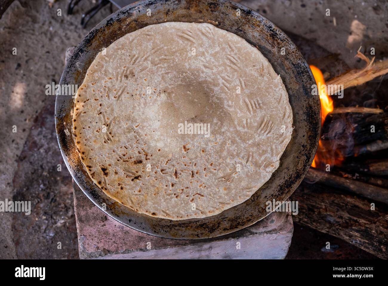 Poor woman in village cooking food. Indian village women pilgrims ...