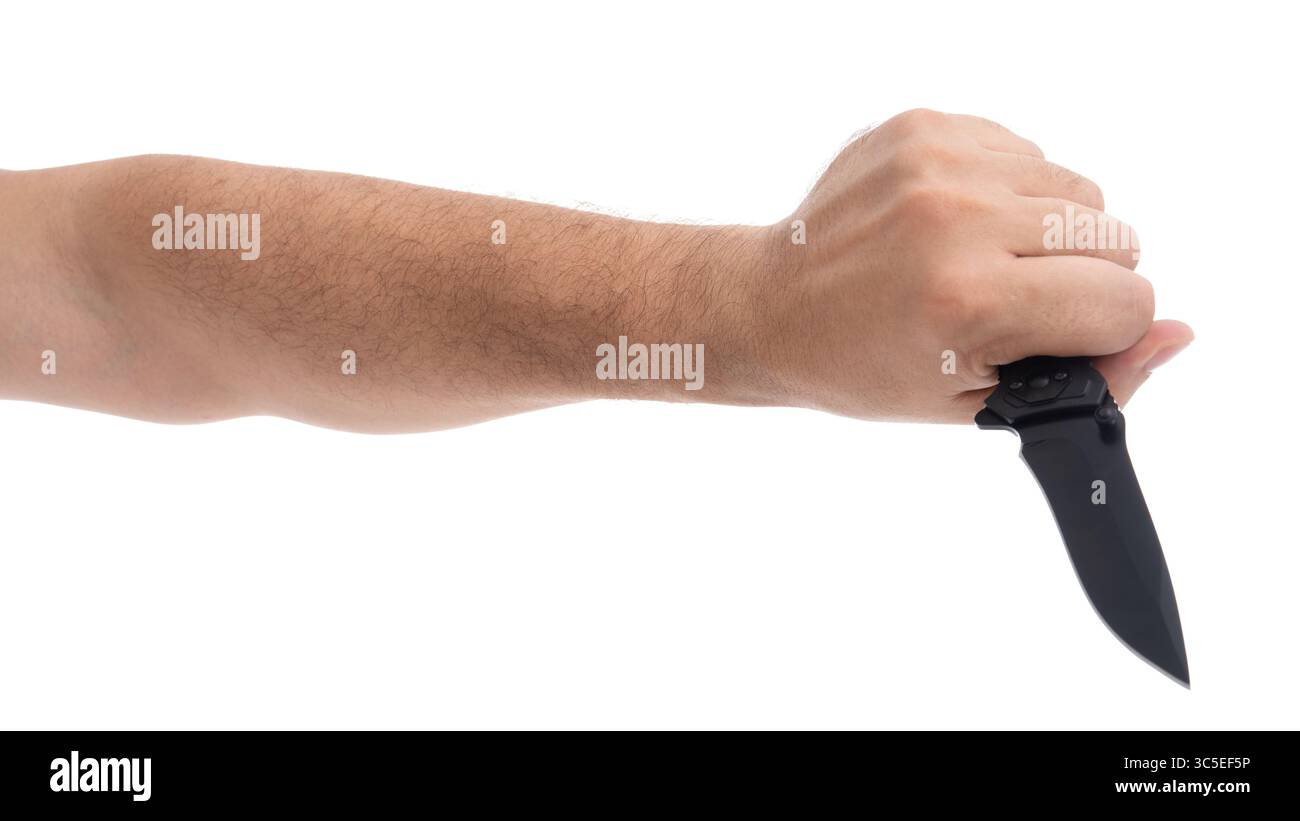 Hand gripping a black folding knife securely Stock Photo - Alamy