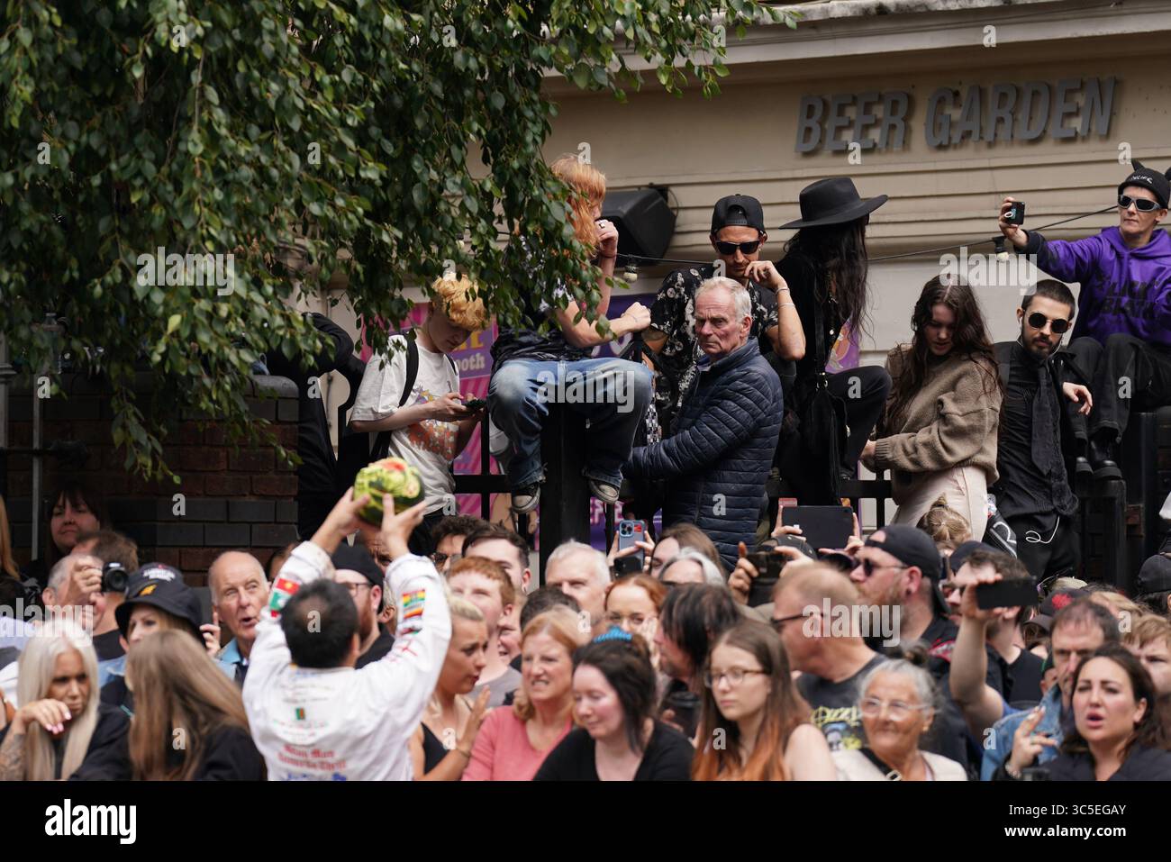 Fans gathering on Broad Street in Birmingham in memory of Black Sabbath ...