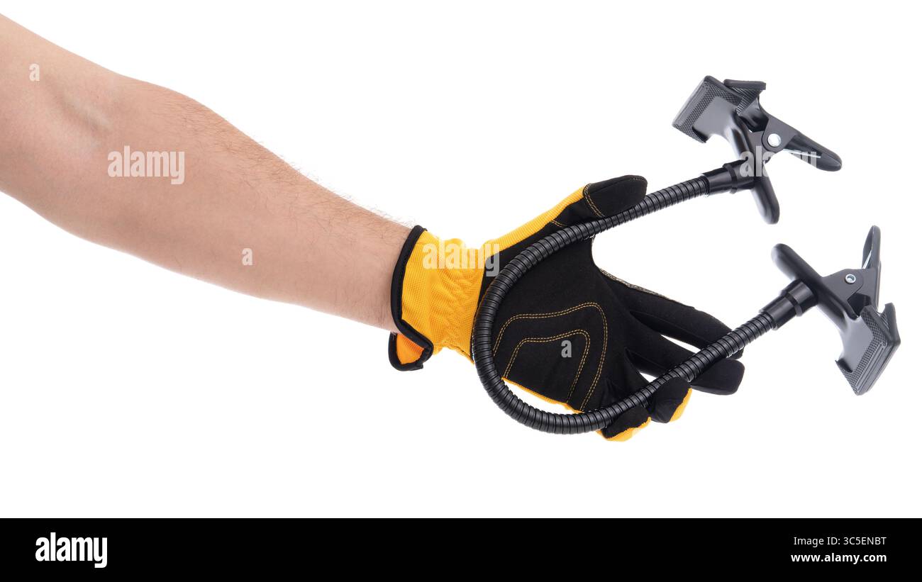 Hand holding flexible clamps for various tasks Stock Photo - Alamy