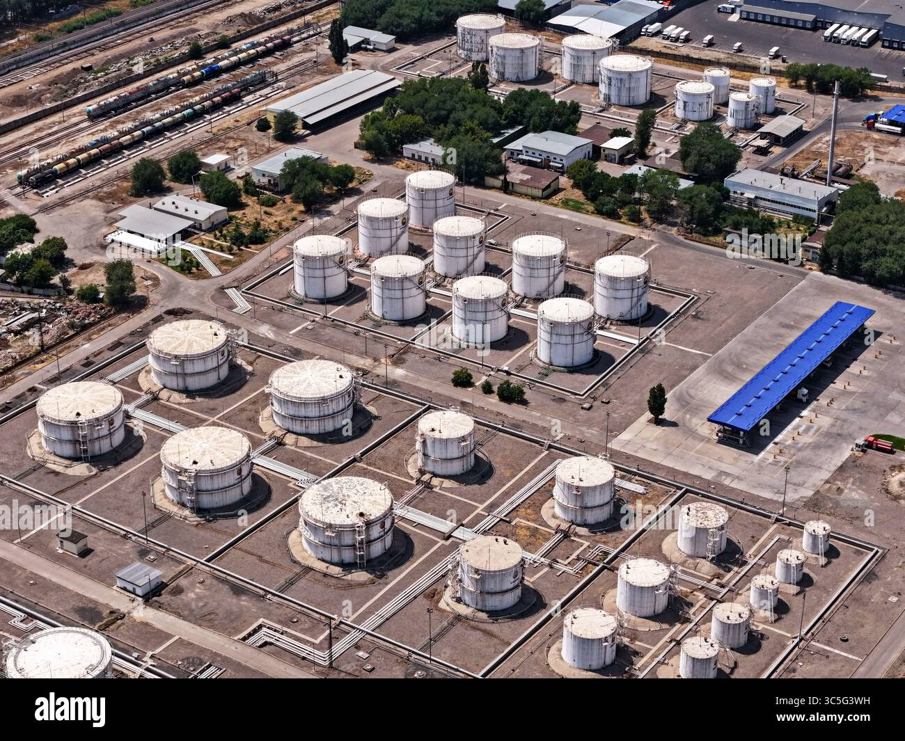 An oil depot with large tanks of various fuels. The view from the drone ...