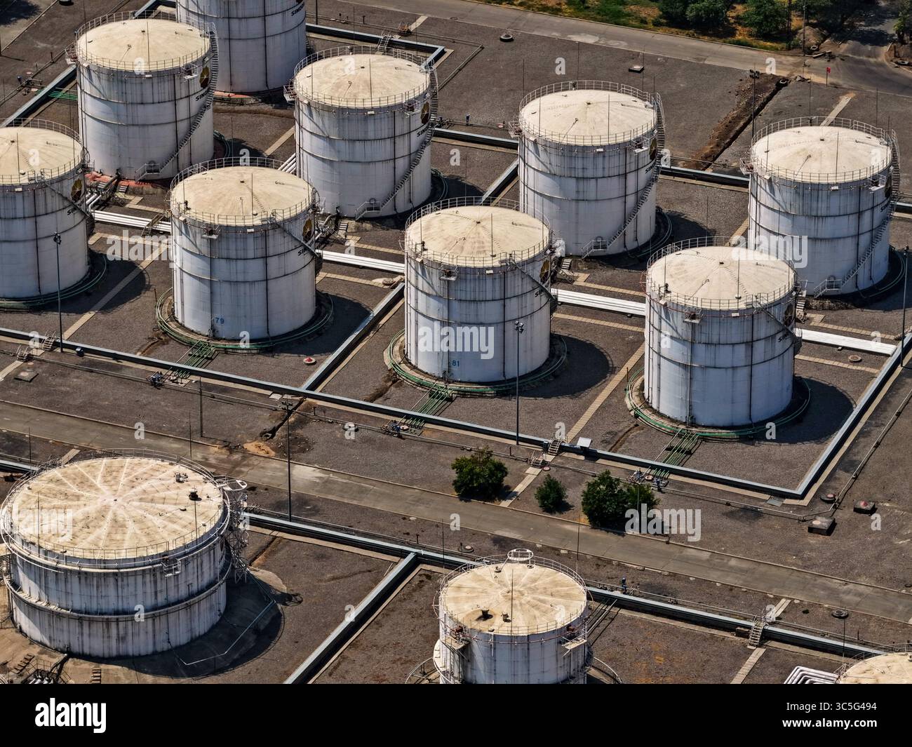 An oil depot with large tanks of various fuels. The view from the drone ...