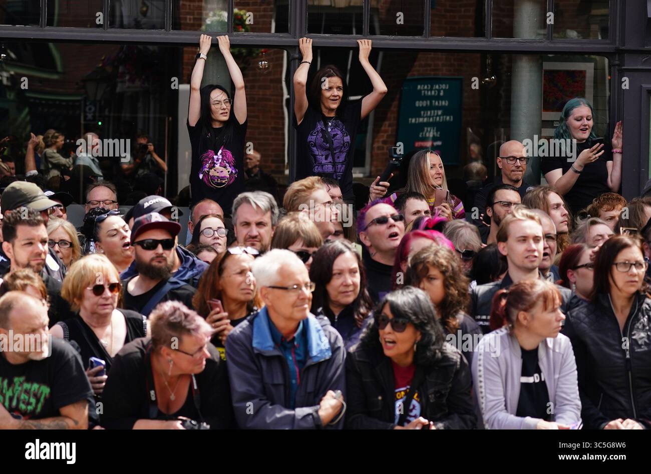 Fans on Broad Street in Birmingham in memory of Black Sabbath frontman ...