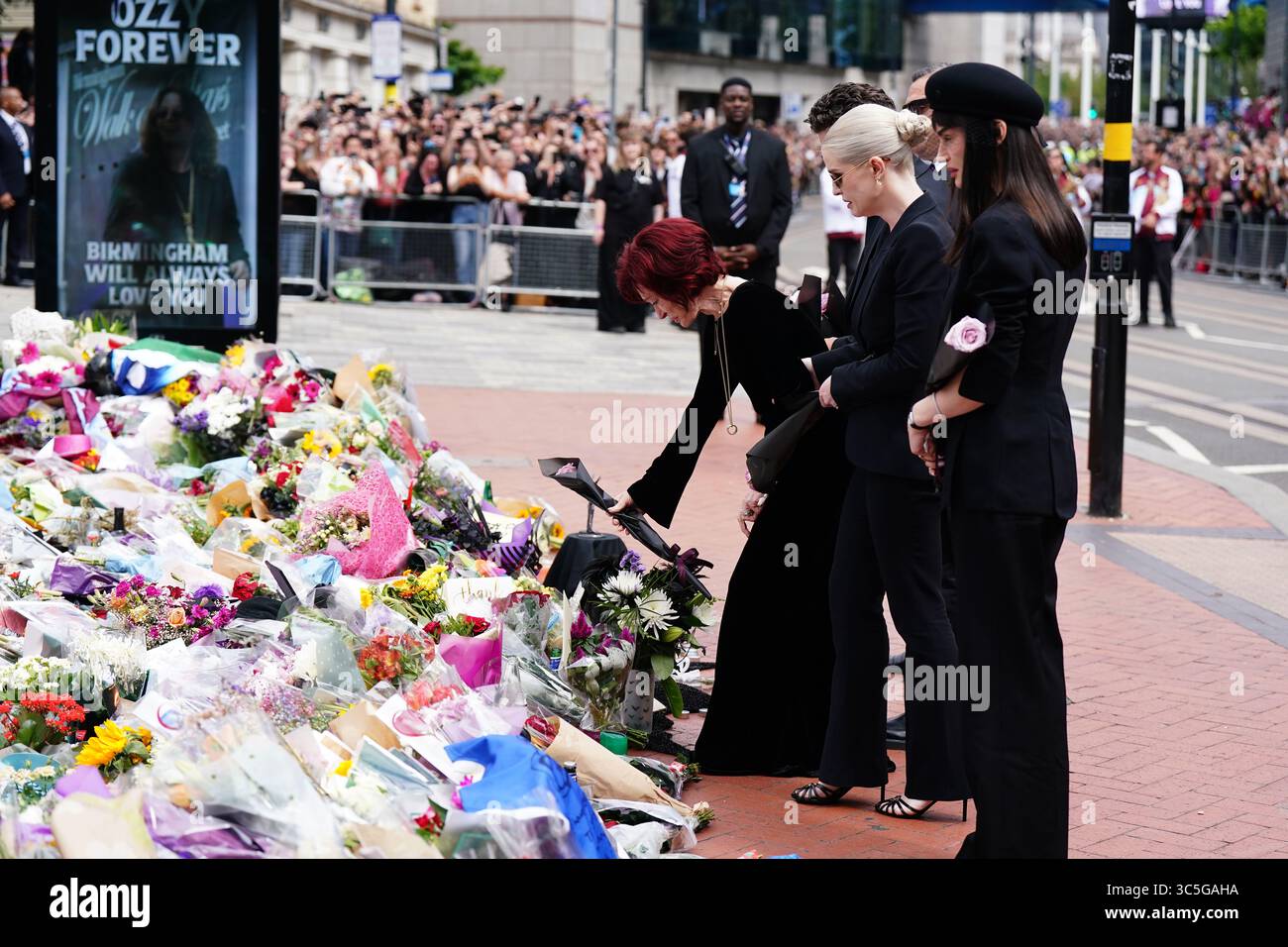 Sharon Osbourne, with family members, lays flowers at the Black Sabbath ...