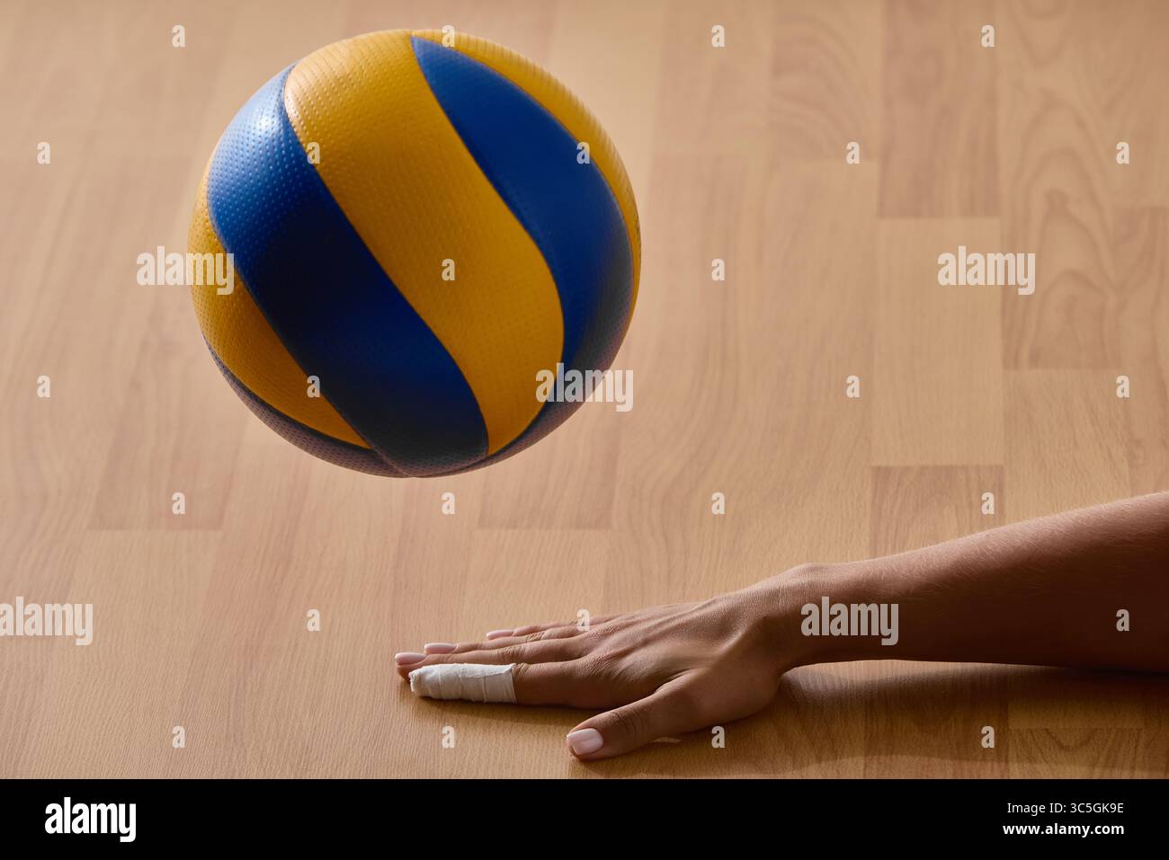 Volleyball player with taped fingers gets ready to receive ball Stock ...