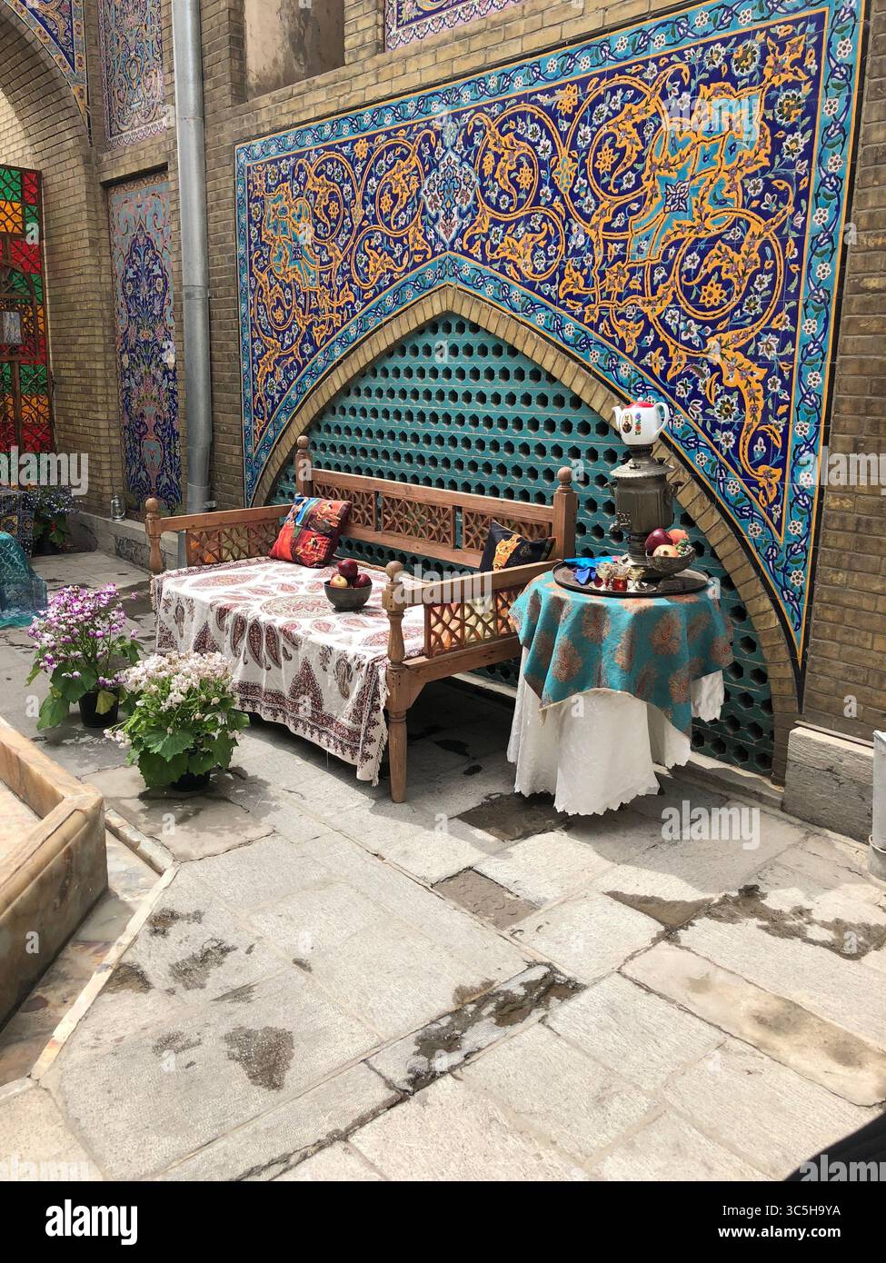 A beautifully decorated traditional Iranian seating area, featuring ...