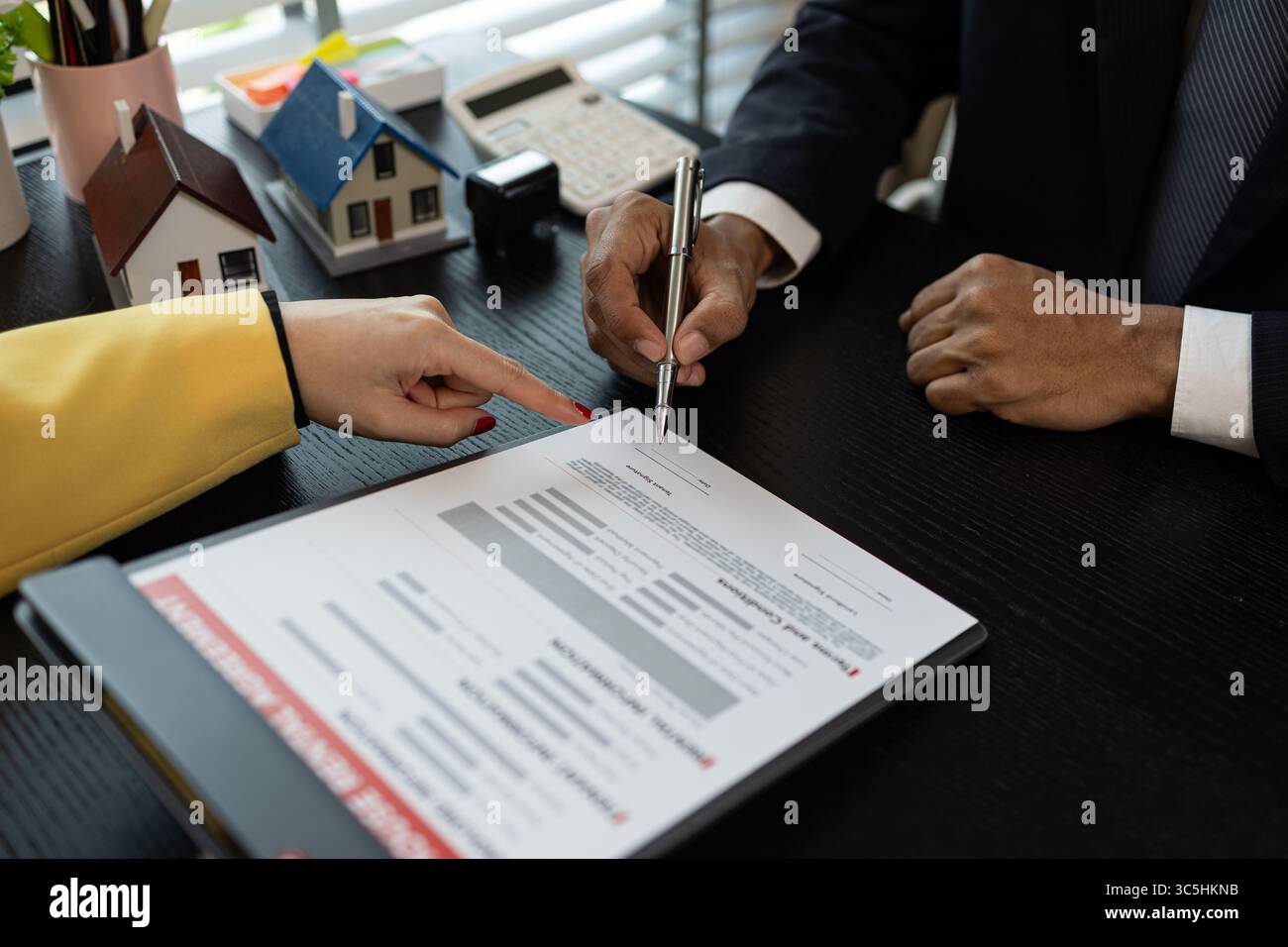 the staff is explaining the details of the rental contract to the ...