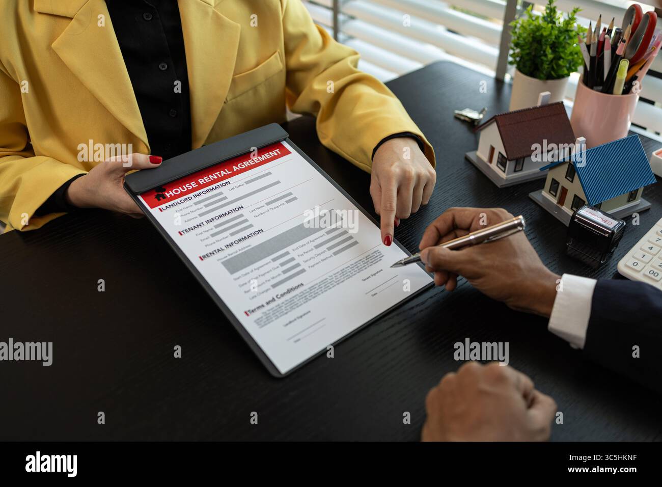 the staff is explaining the details of the rental contract to the ...