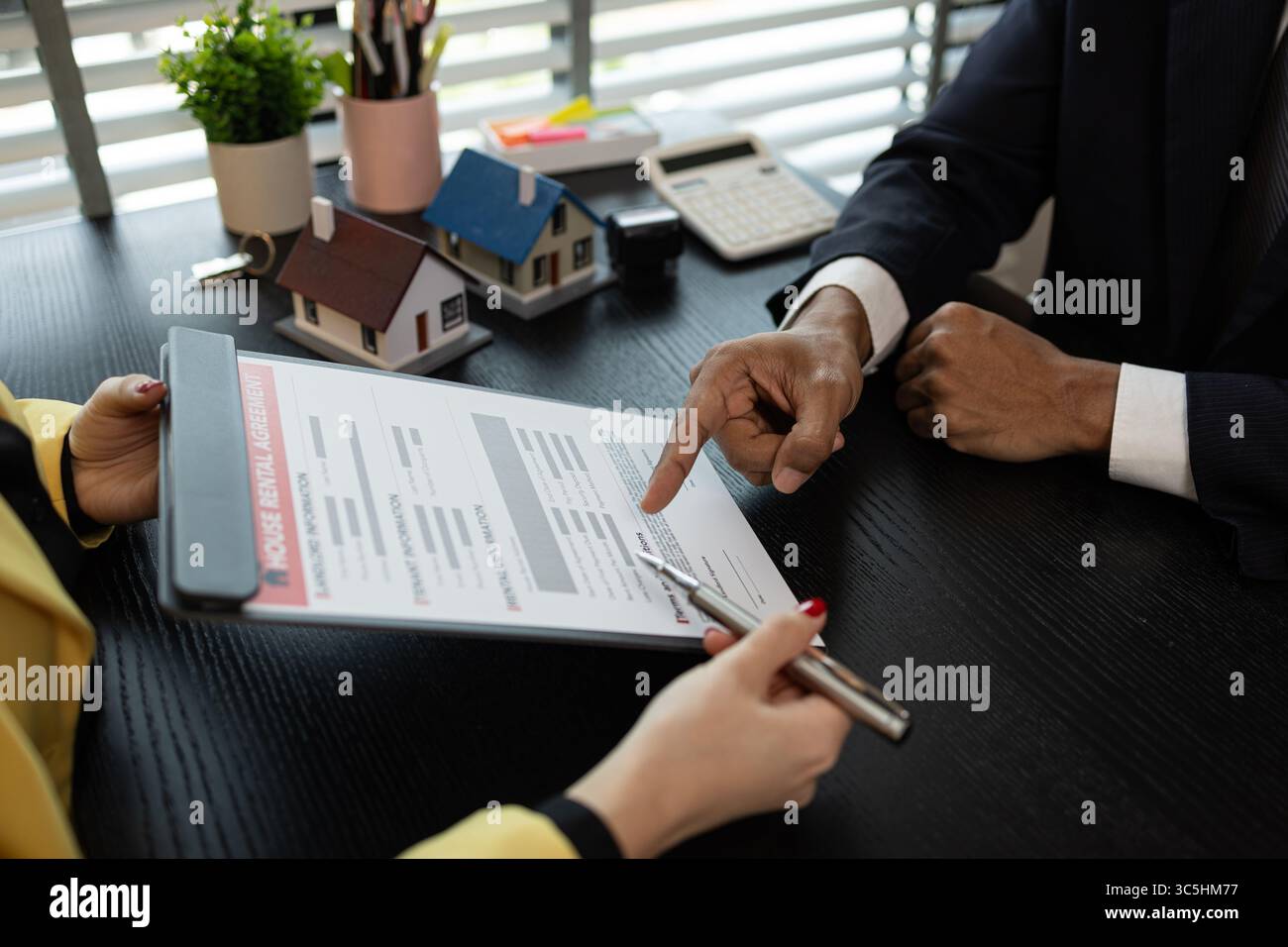 the staff is explaining the details of the rental contract to the ...
