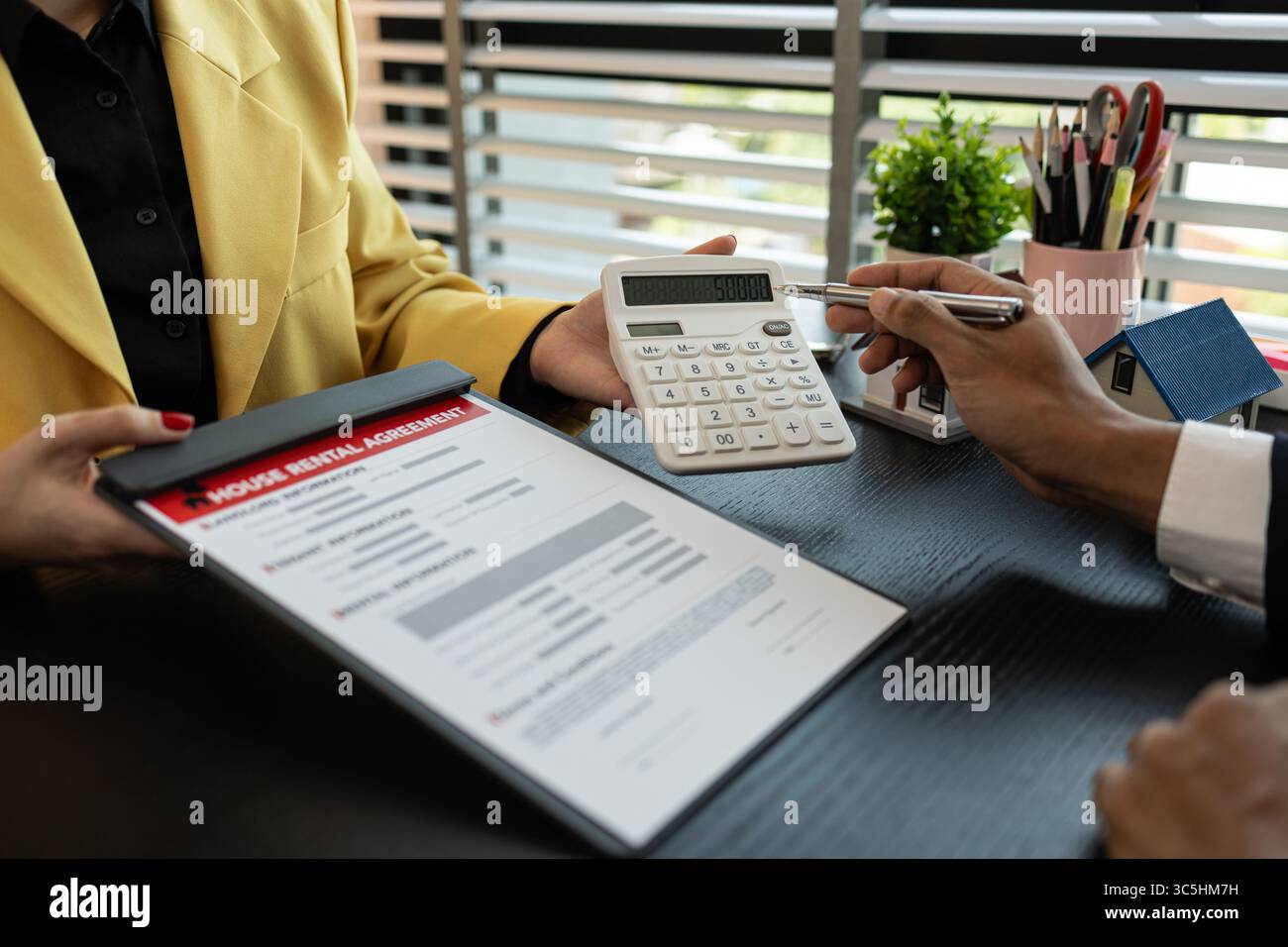 the staff is explaining the details of the rental contract to the ...