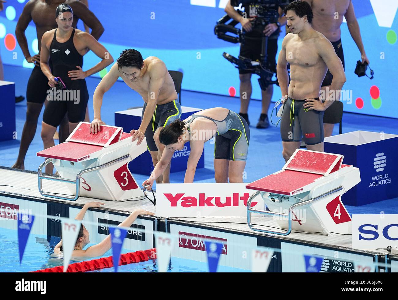 Singapore, Wu Qingfeng (bottom) and Qin Haiyang are seen after the ...