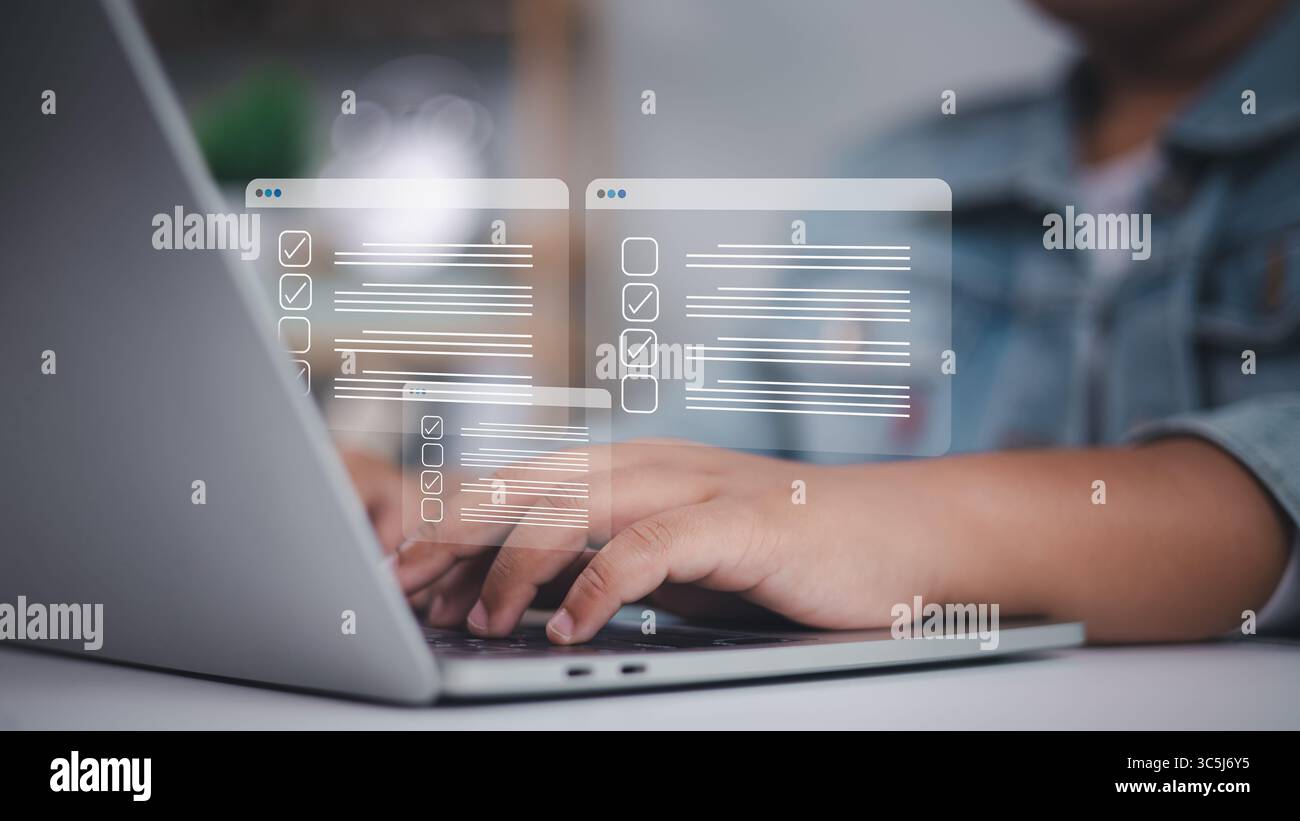 Checklists, documents, and online forms appear in holographic windows as a person types on a ...