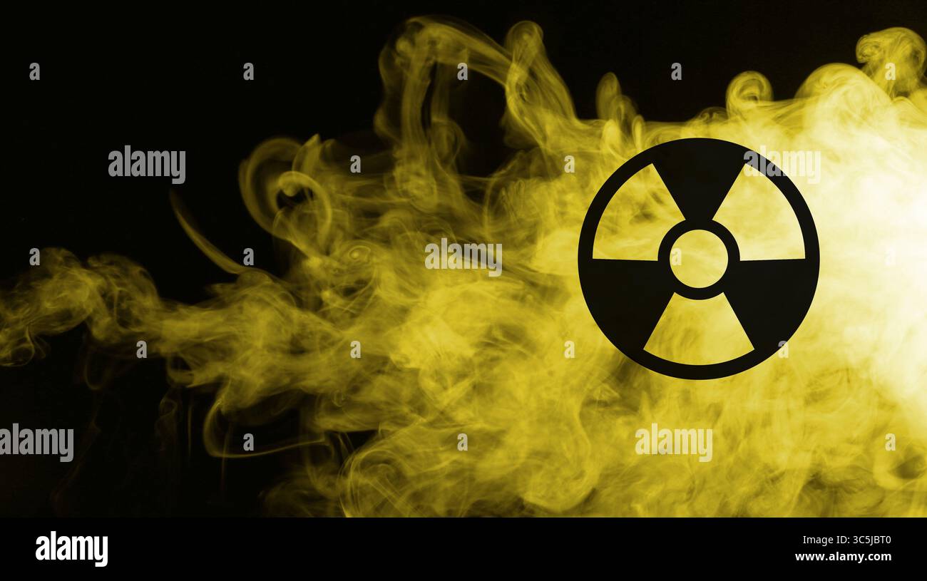 Radioactive sign and yellow toxic smoke against black background ...